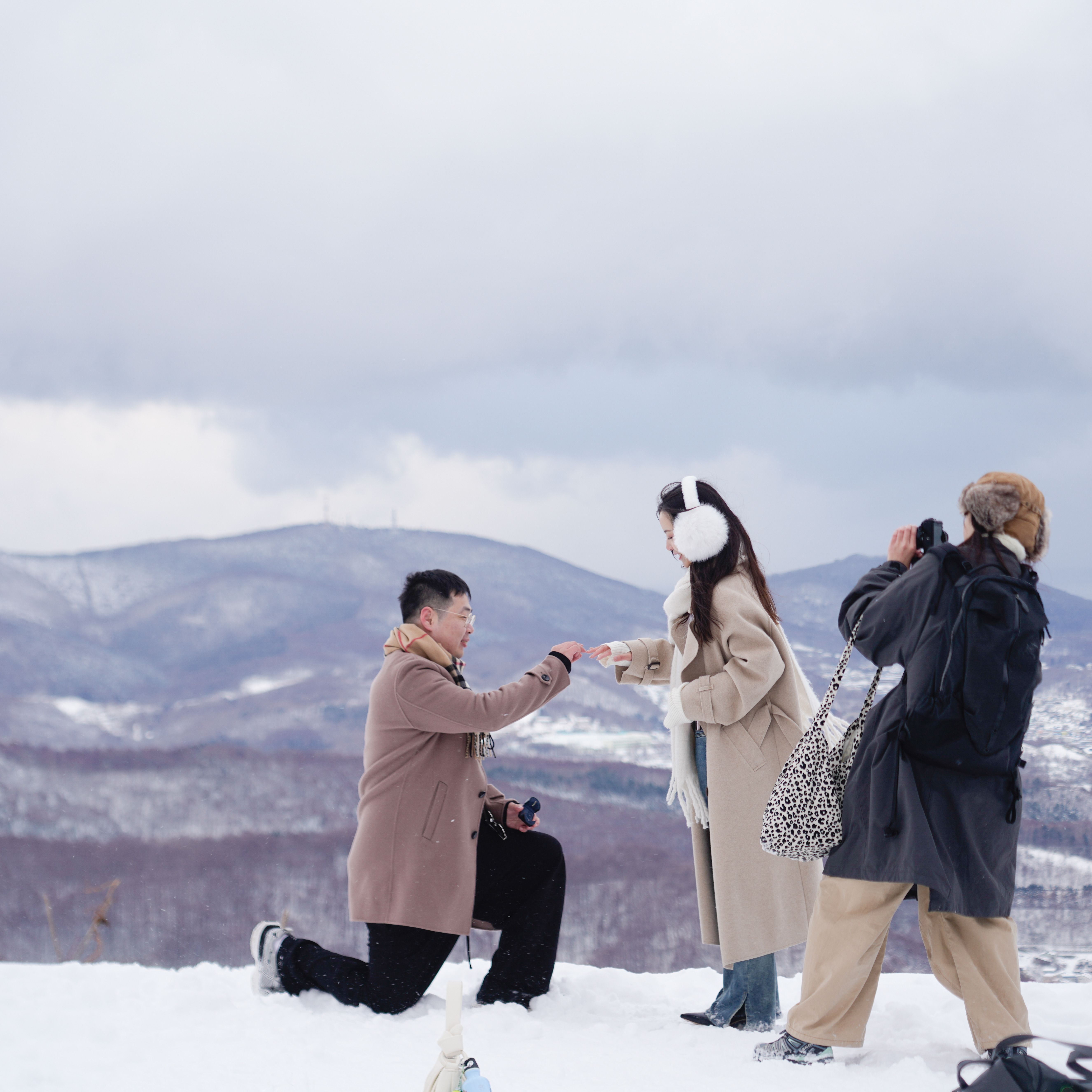 Man Proposing in Snowy Mountain Landscape · Free Stock Photo