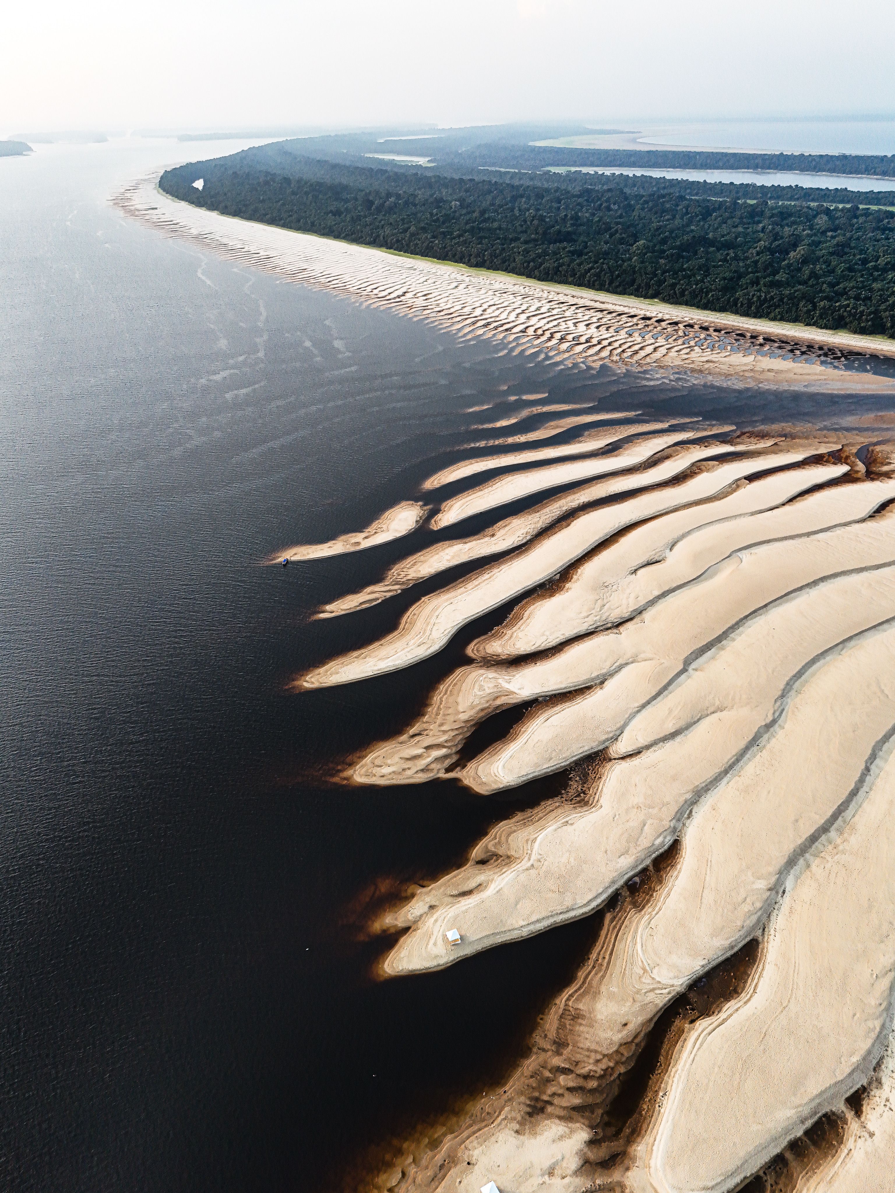Aerial View of Coastal Sand Dunes and Water · Free Stock Photo