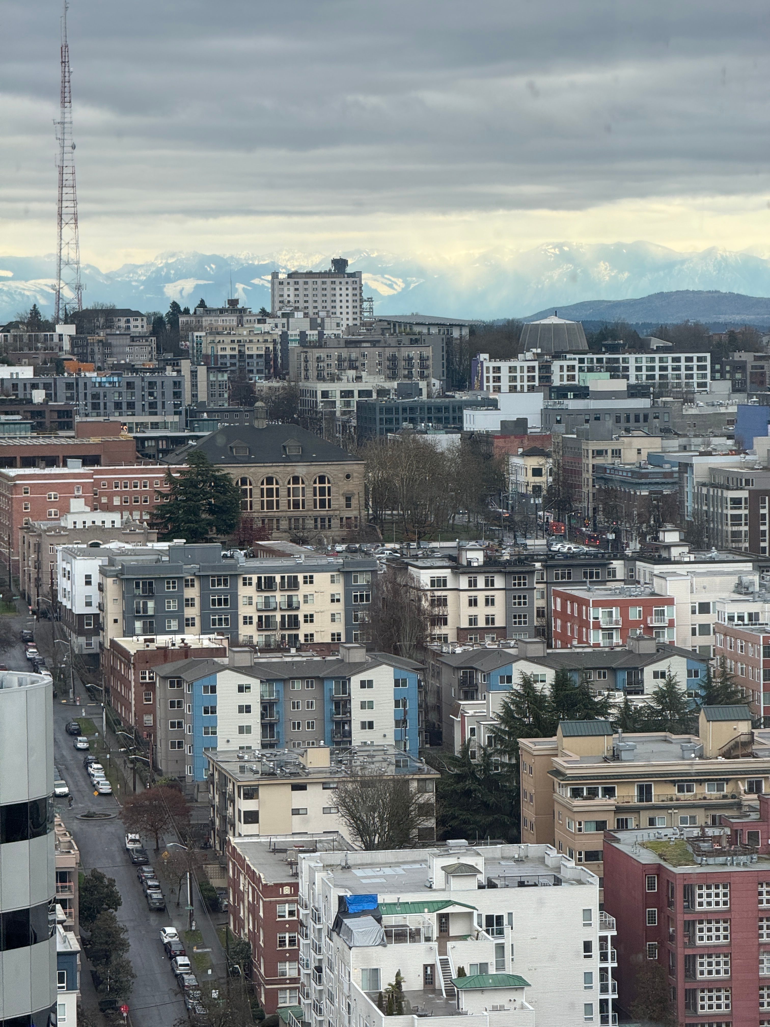 Urban Landscape with Distant Snowy Mountains · Free Stock Photo