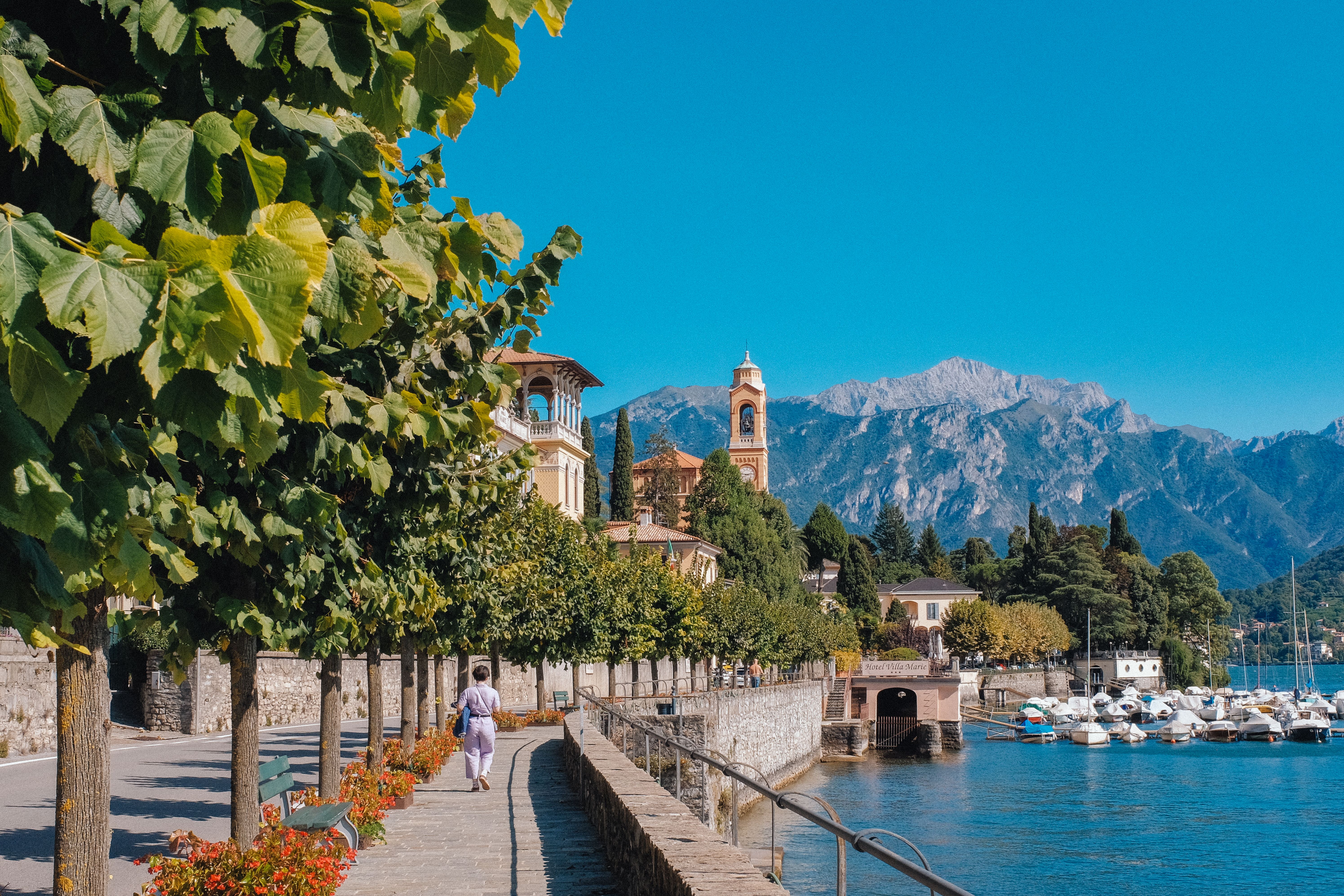 Picturesque Lakeside Walkway with Mountains · Free Stock Photo