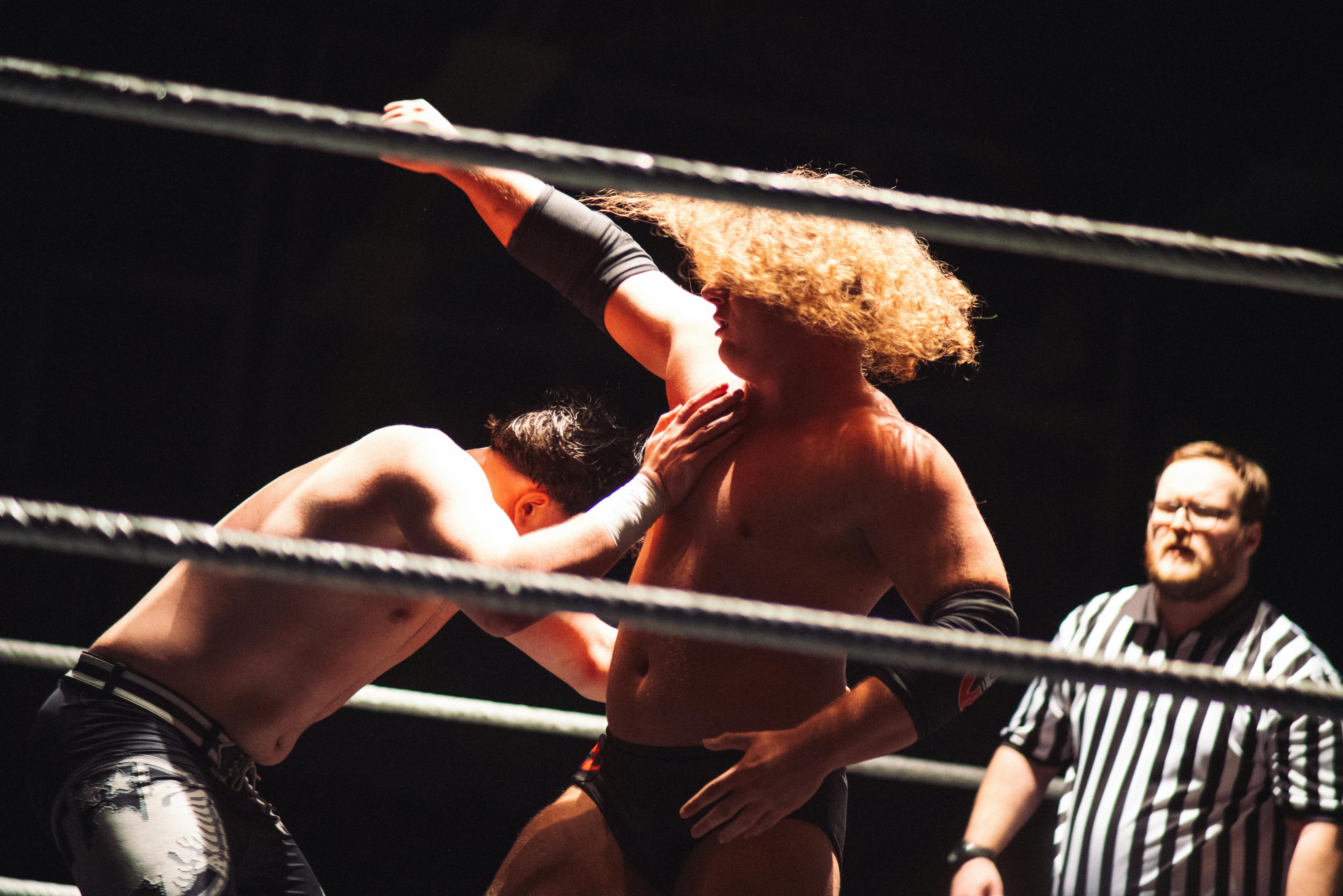 Intense Wrestling Match in the Ring · Free Stock Photo