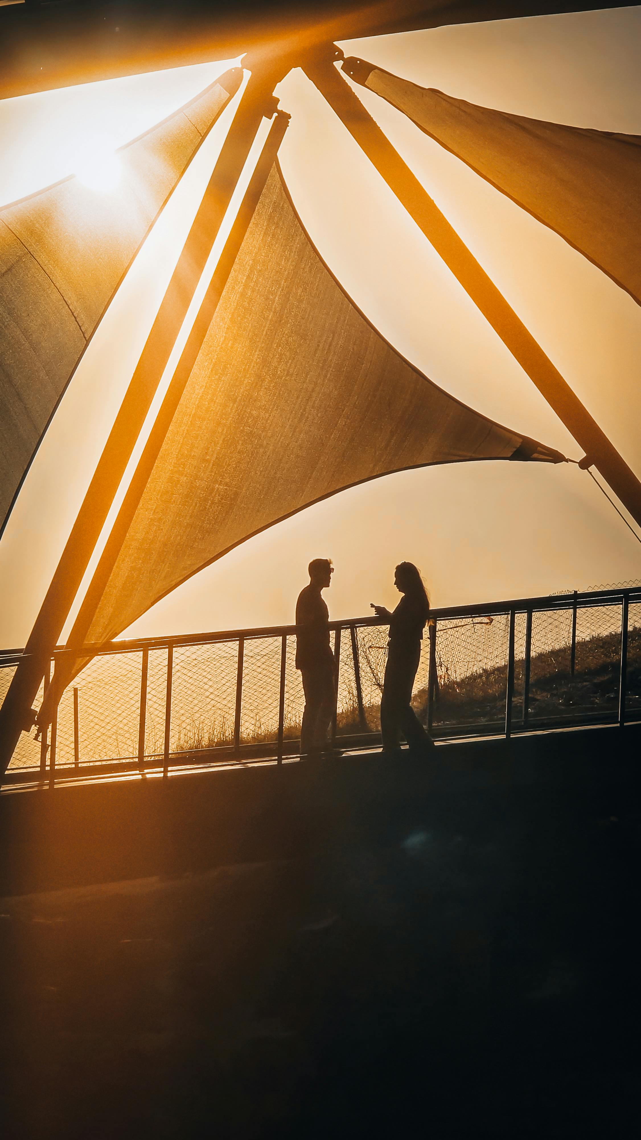 Silhouettes at Sunset on Şanlıurfa Bridge · Free Stock Photo