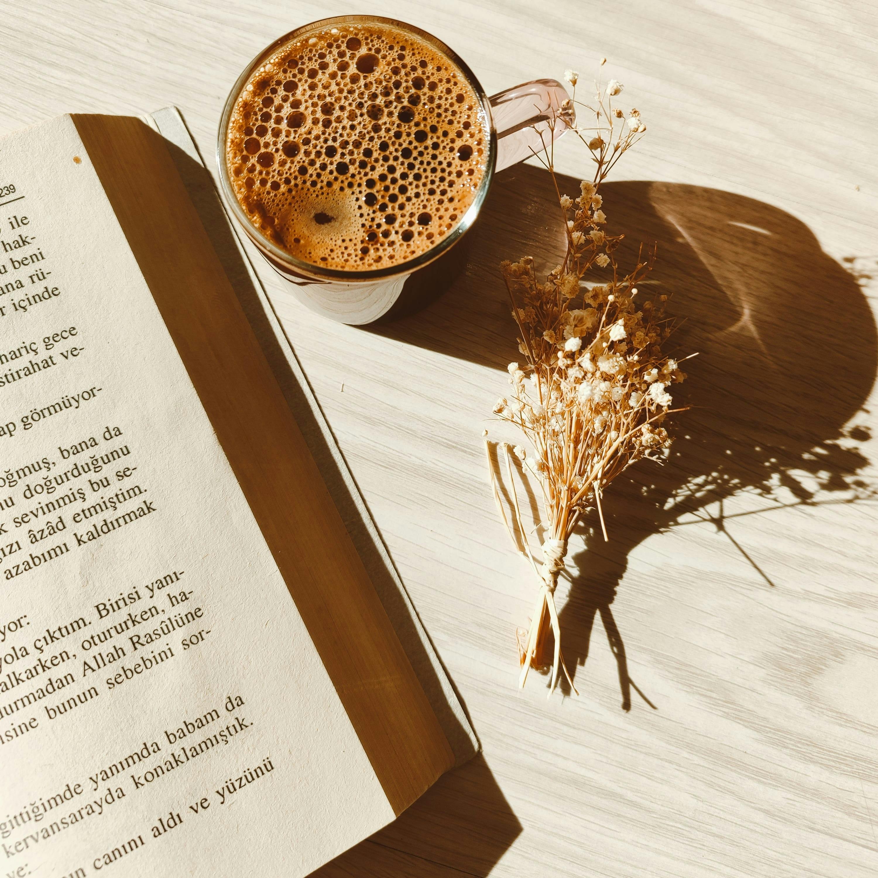 Cozy morning coffee with book and dried flowers · Free Stock Photo