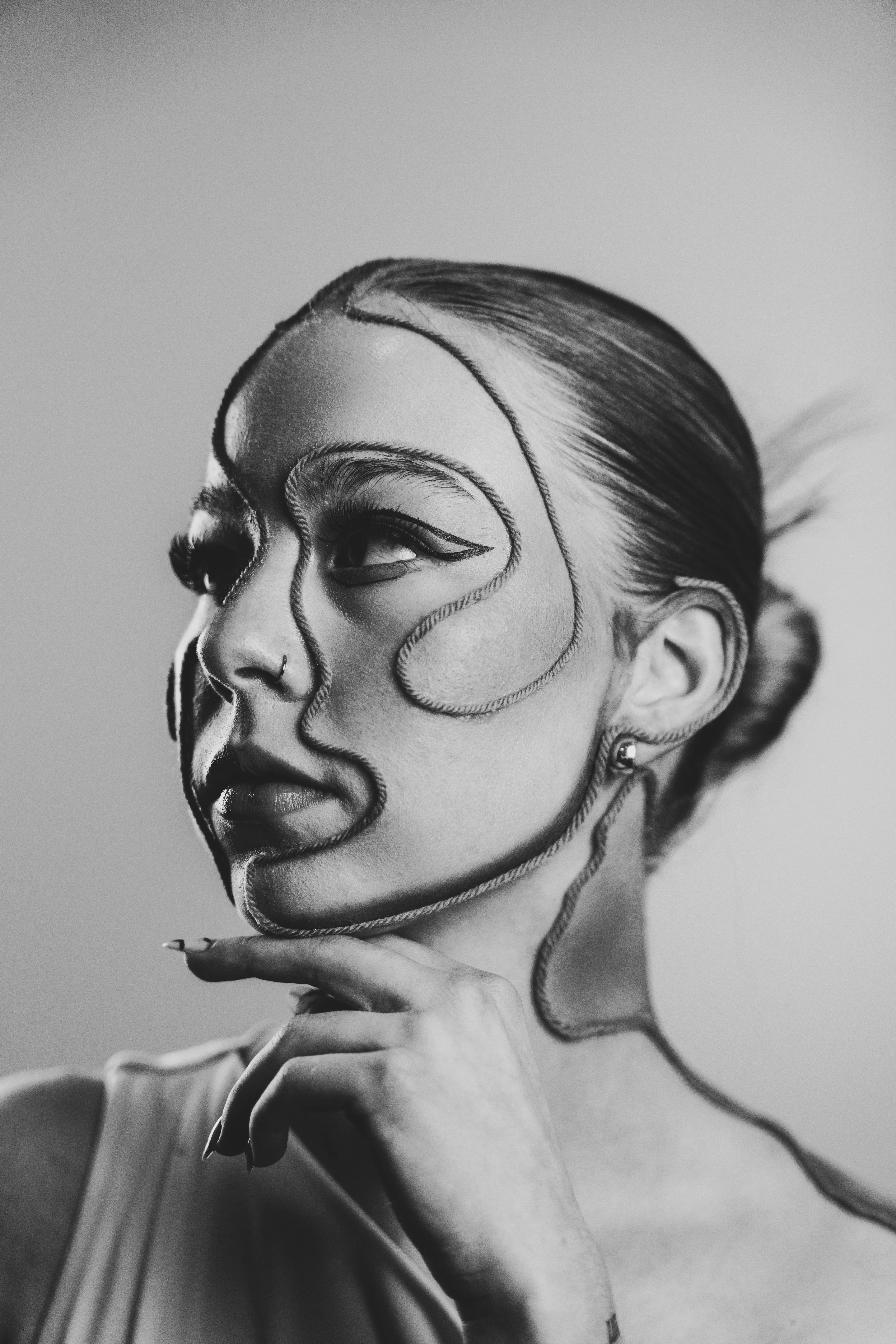 Creative Portrait with Artistic Face Lines in Studio · Free Stock Photo