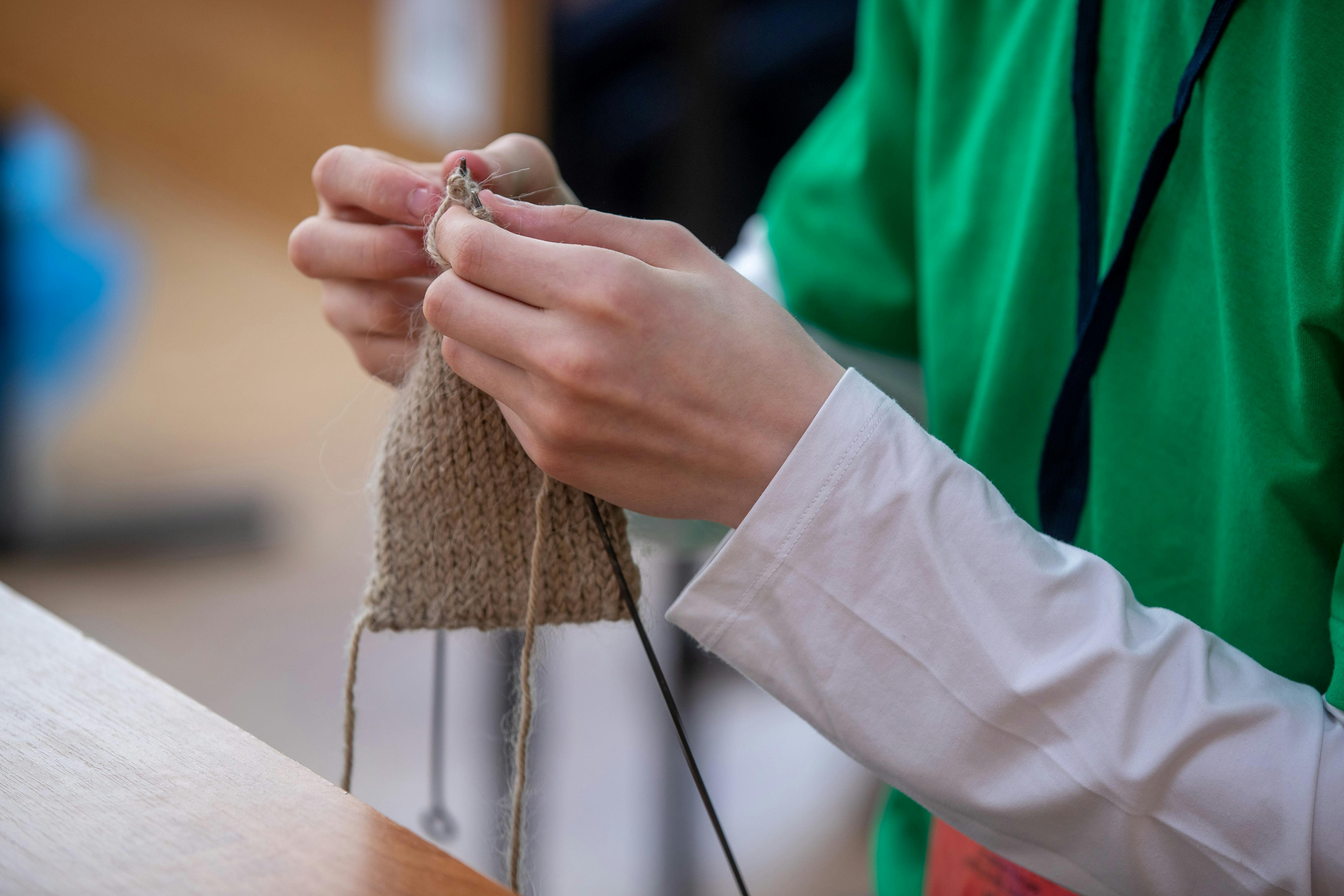 Person Holding Brown Yarn Roll · Free Stock Photo