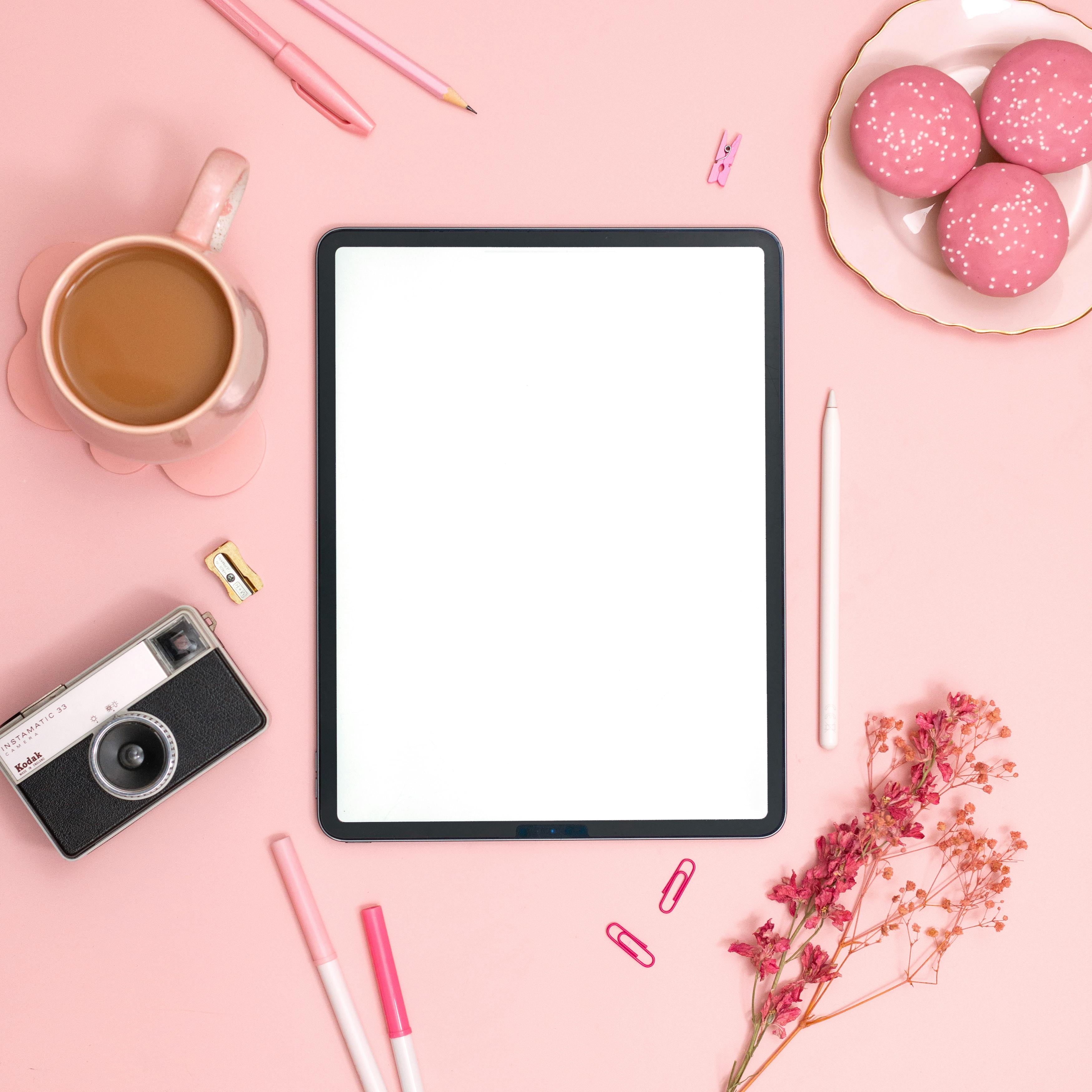 Pink Aesthetic Workspace with Tablet and Cupcakes · Free Stock Photo