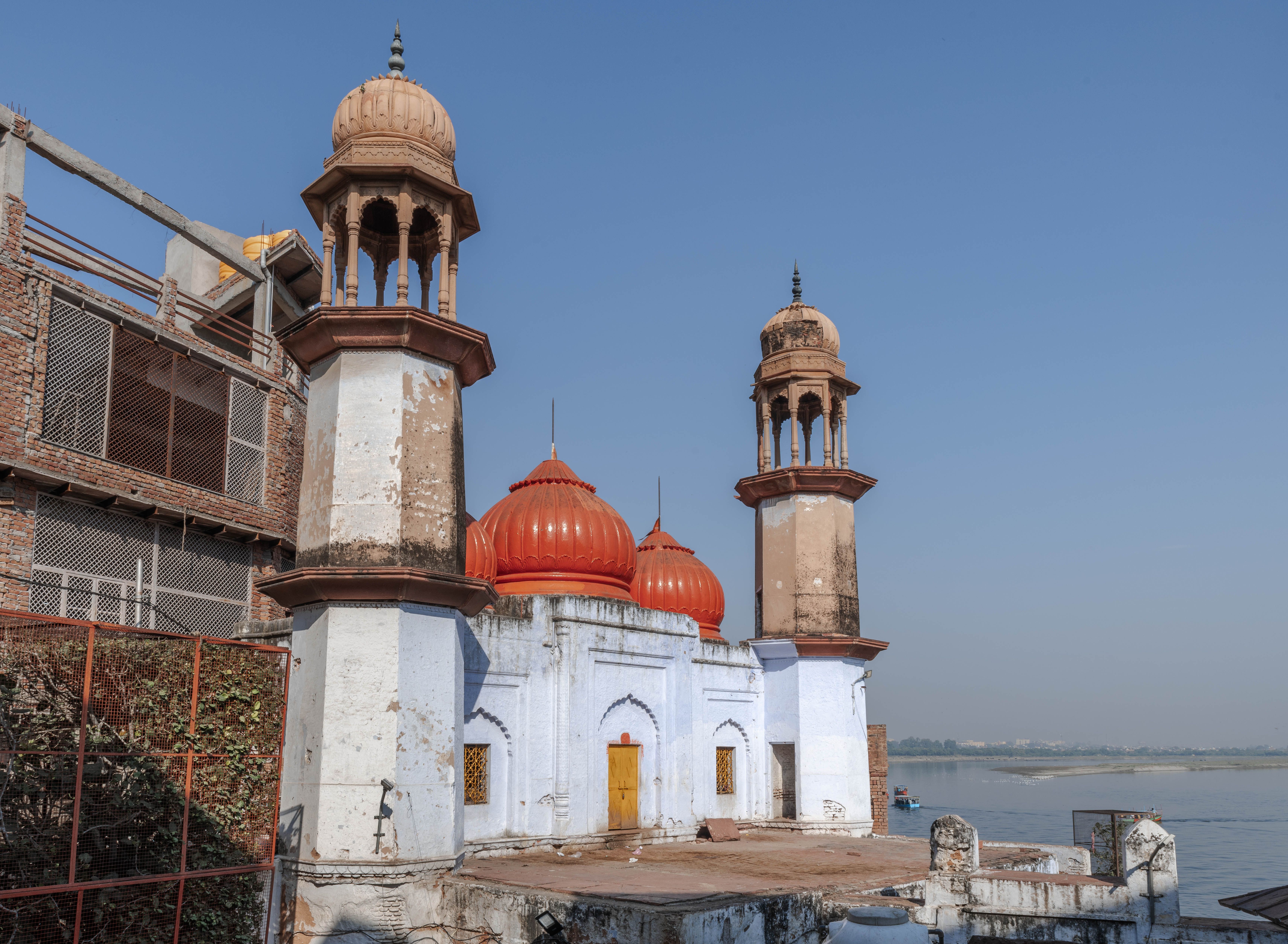 Historic Red Dome Temple by Yamuna River · Free Stock Photo