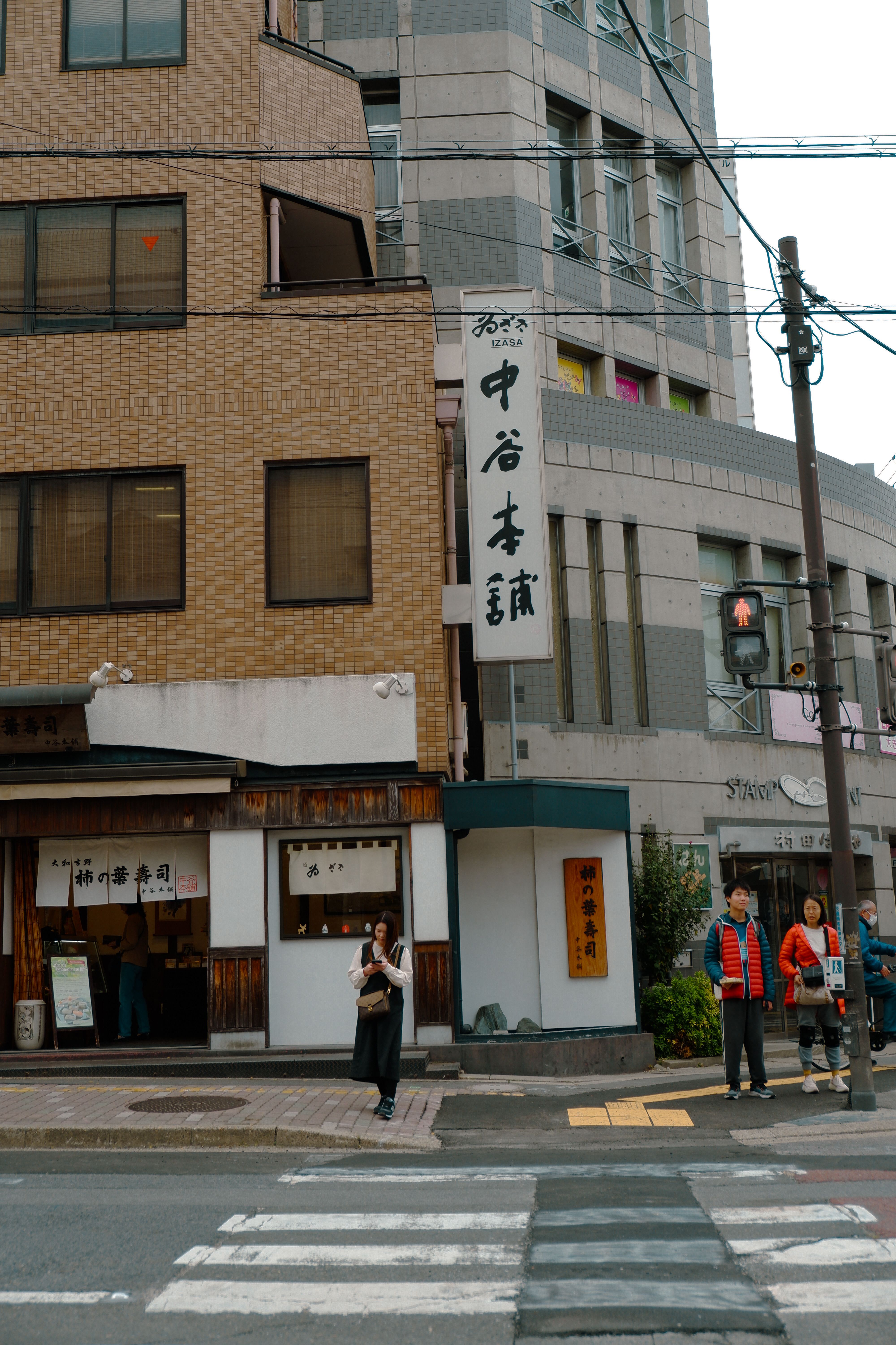 Urban Street Scene with Pedestrians and Buildings · Free Stock Photo
