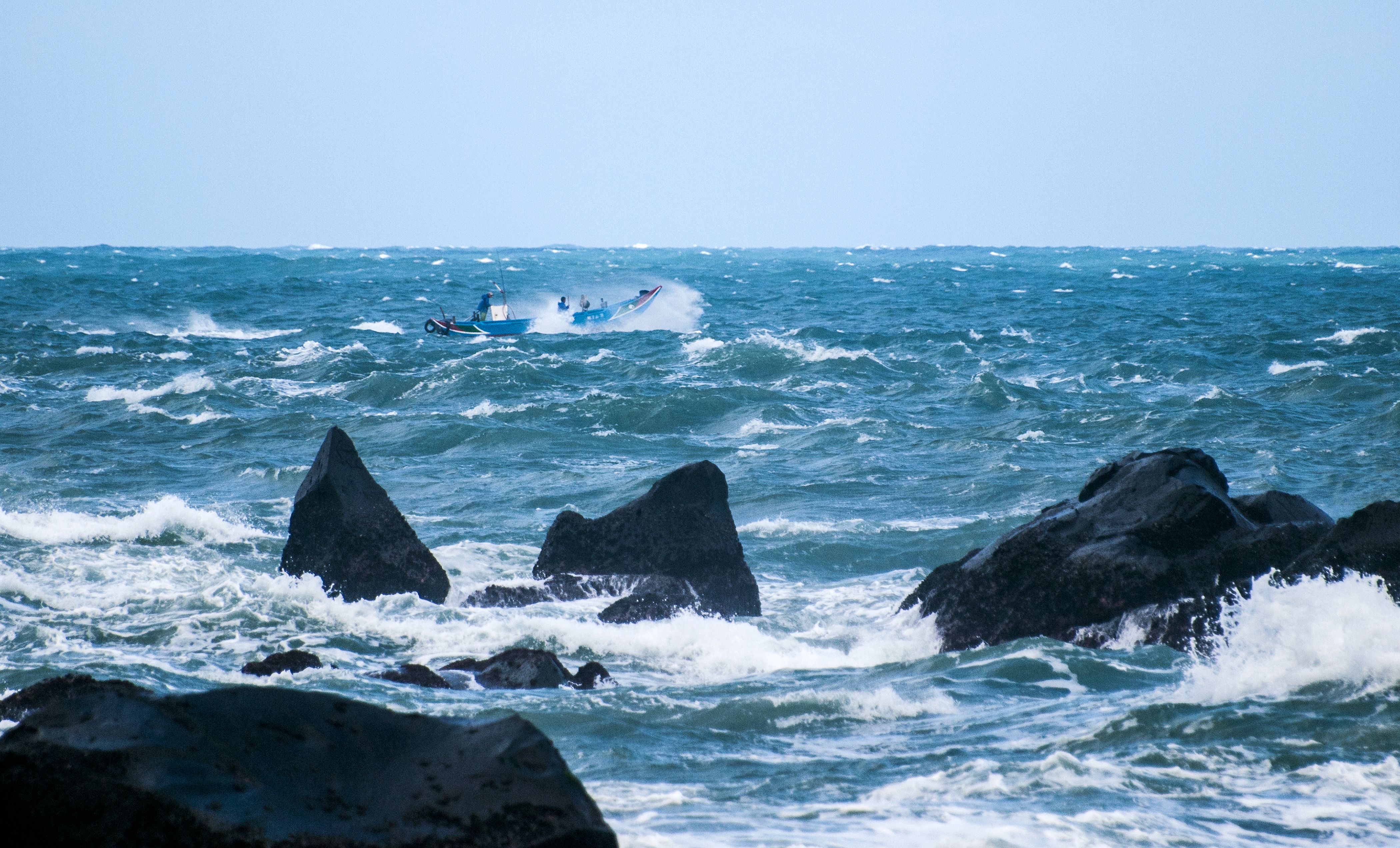 Dynamic Ocean Scene with Fishing Boat in Rough Seas · Free Stock Photo