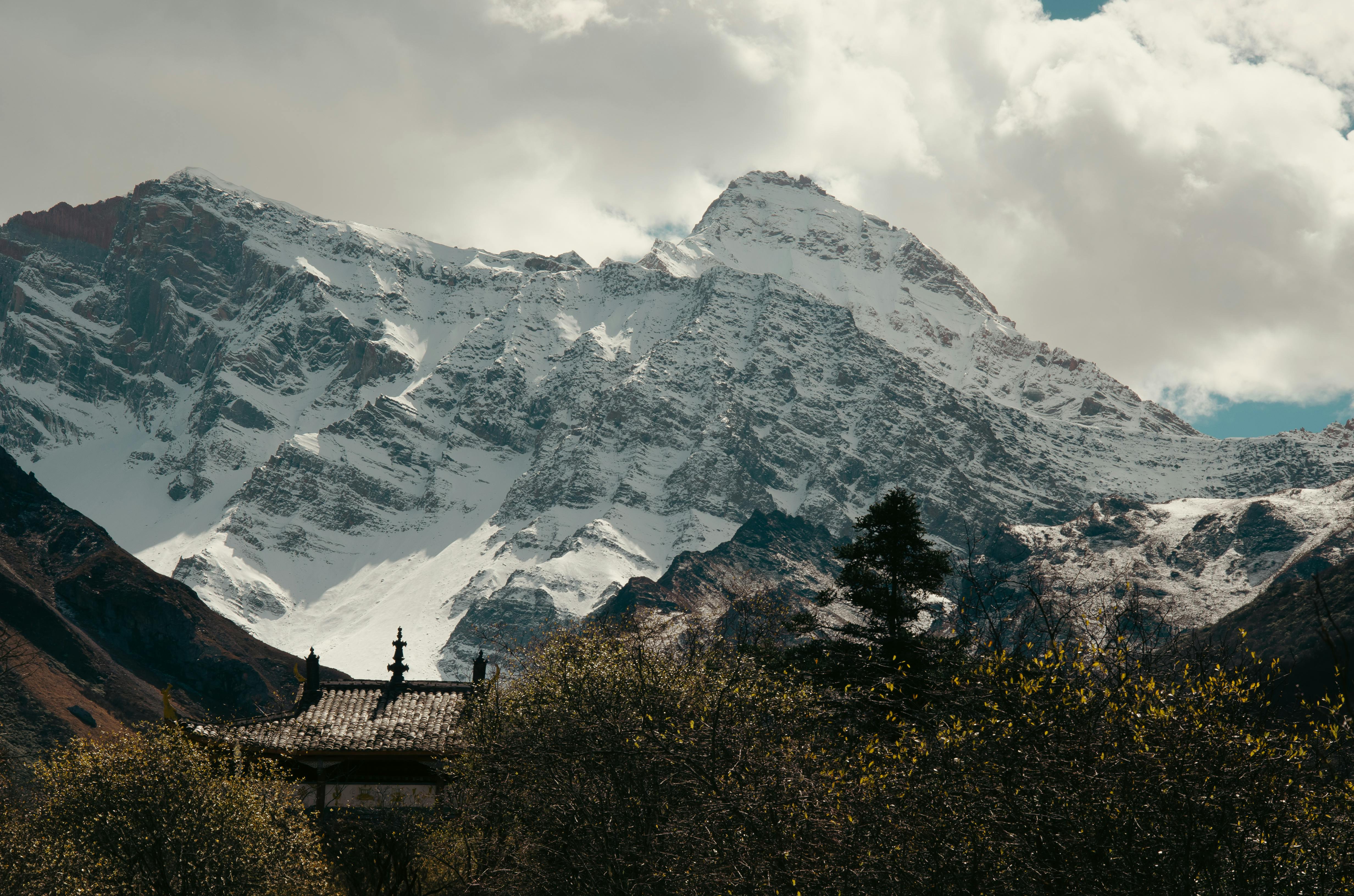 Majestic Snow-Capped Mountain with Temple View · Free Stock Photo