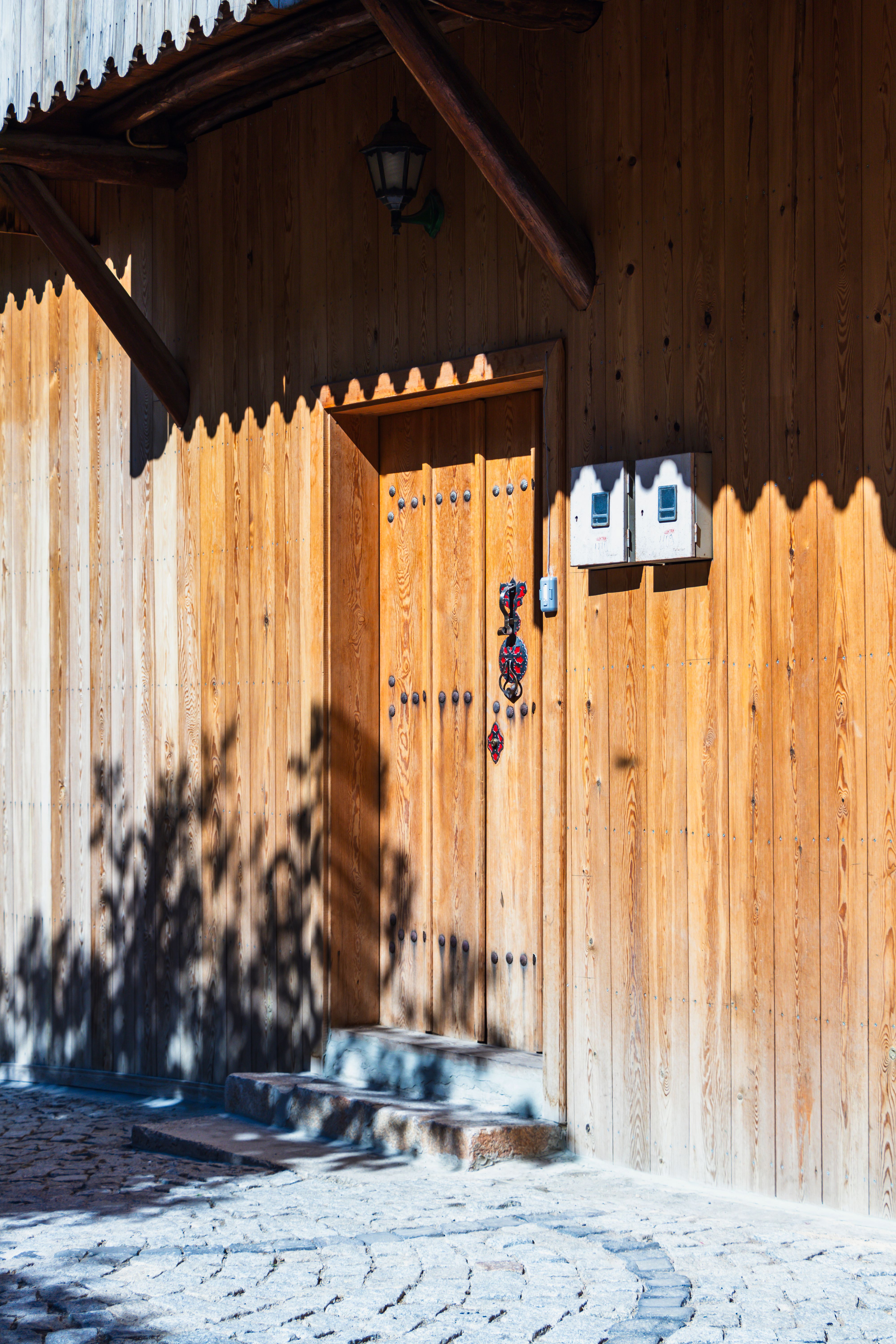 Warm Wooden Doorway on Rustic Building · Free Stock Photo