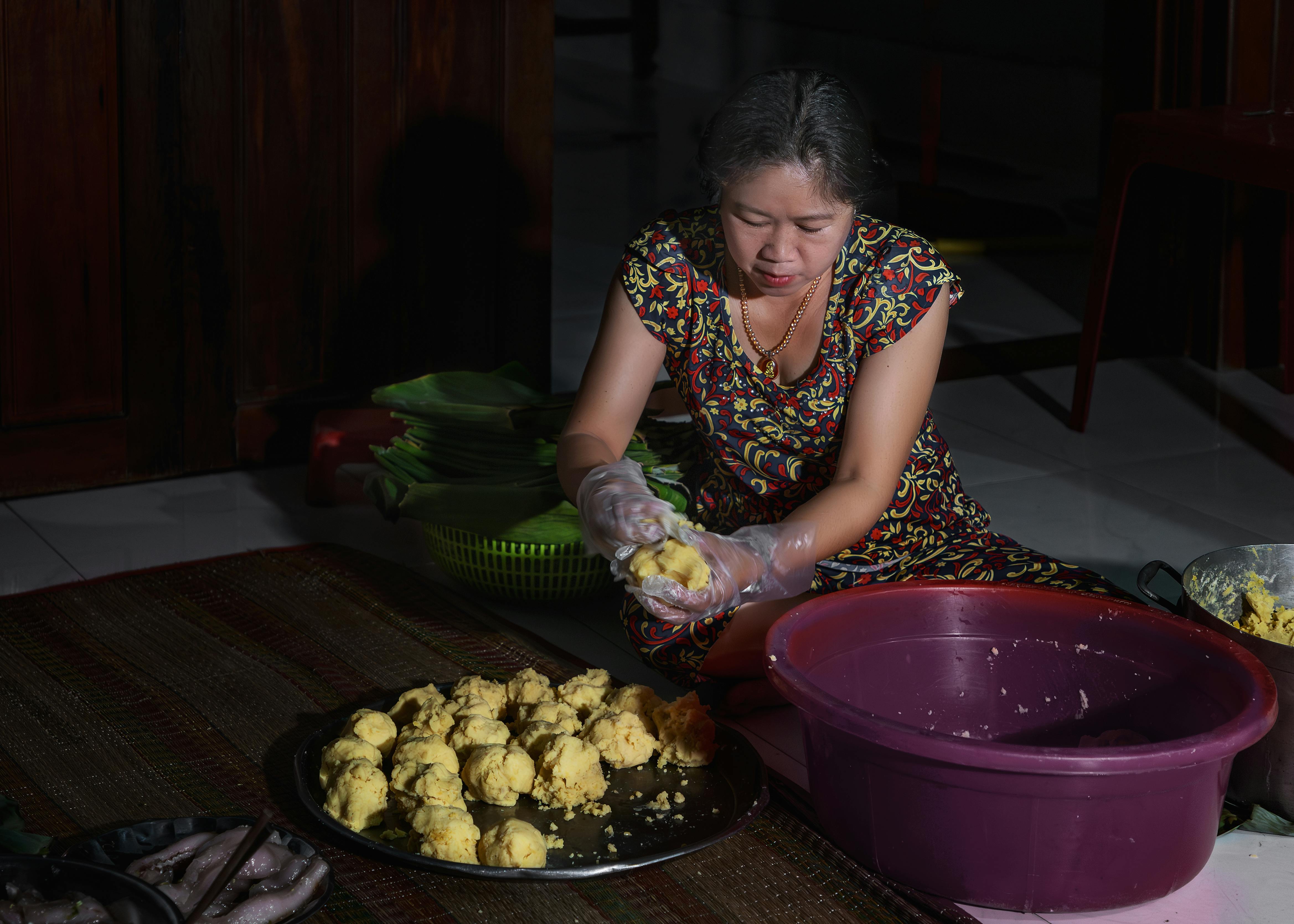 Vietnamese Woman Preparing Traditional Food Indoors · Free Stock Photo
