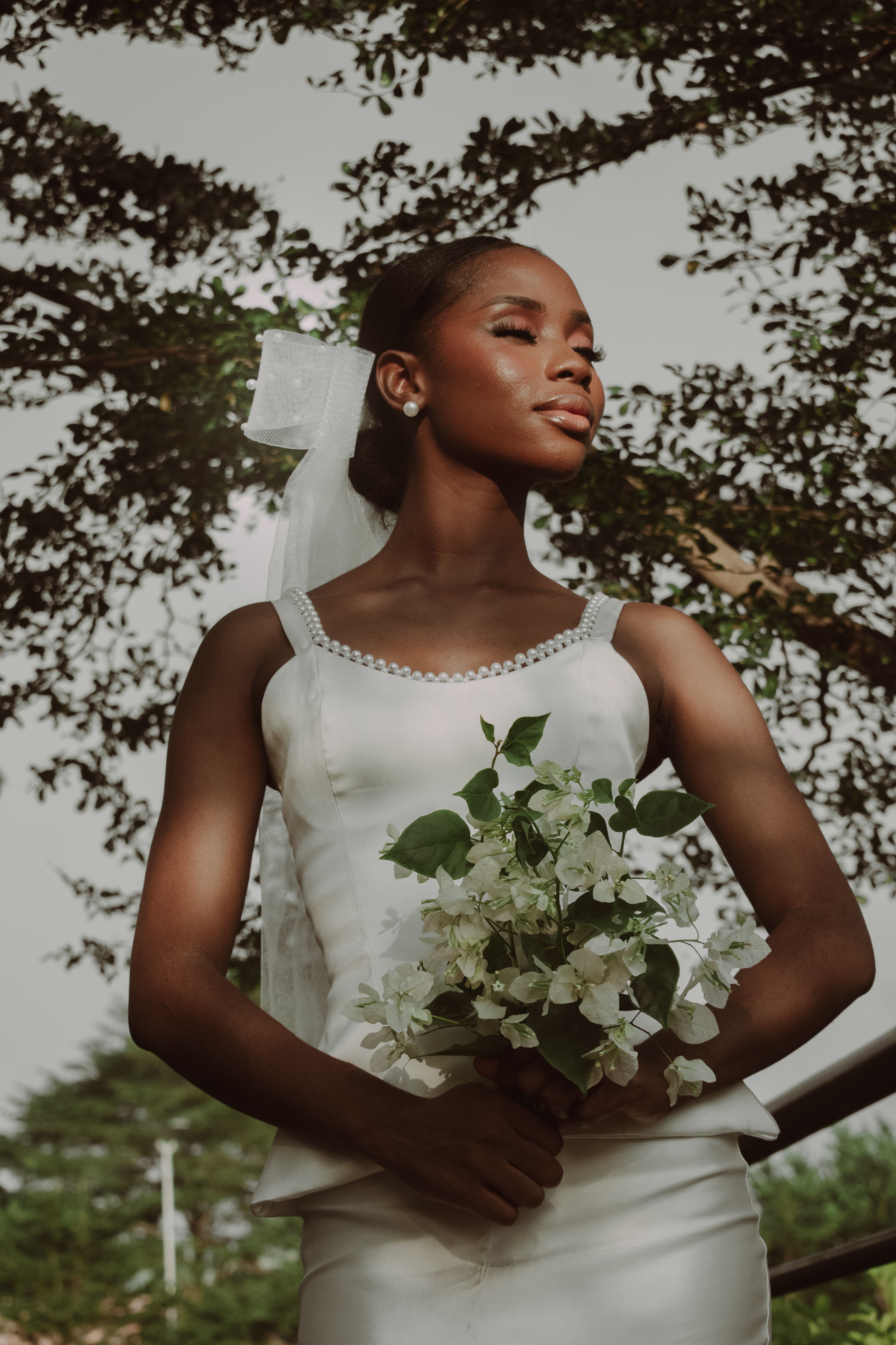 Elegant Outdoor Bridal Portrait in Garden Setting · Free Stock Photo