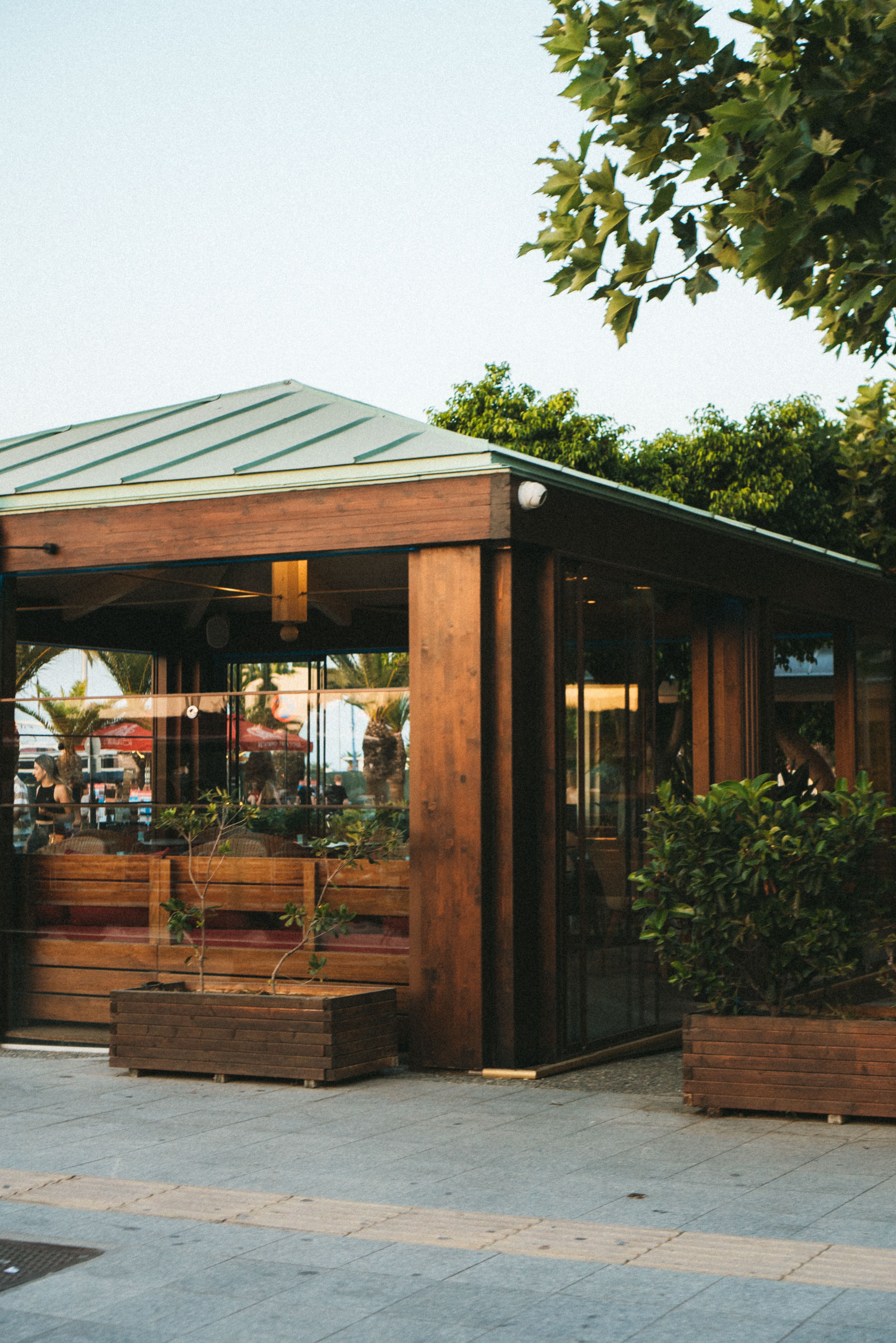 Modern Outdoor Café with Wooden Structure · Free Stock Photo