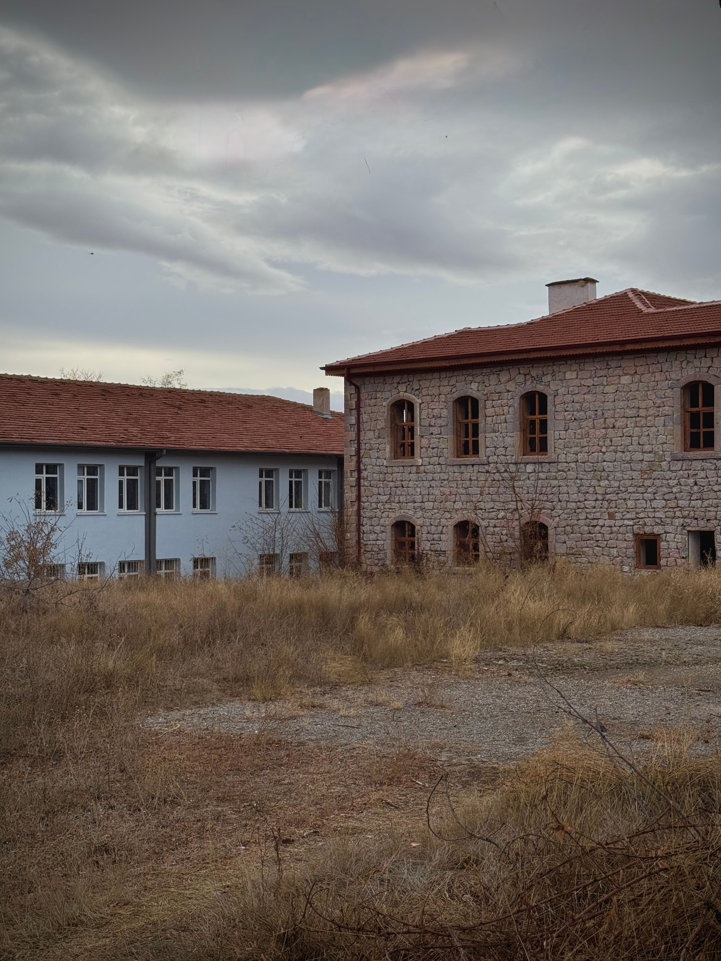 Historic Stone and Modern Building Contrast · Free Stock Photo