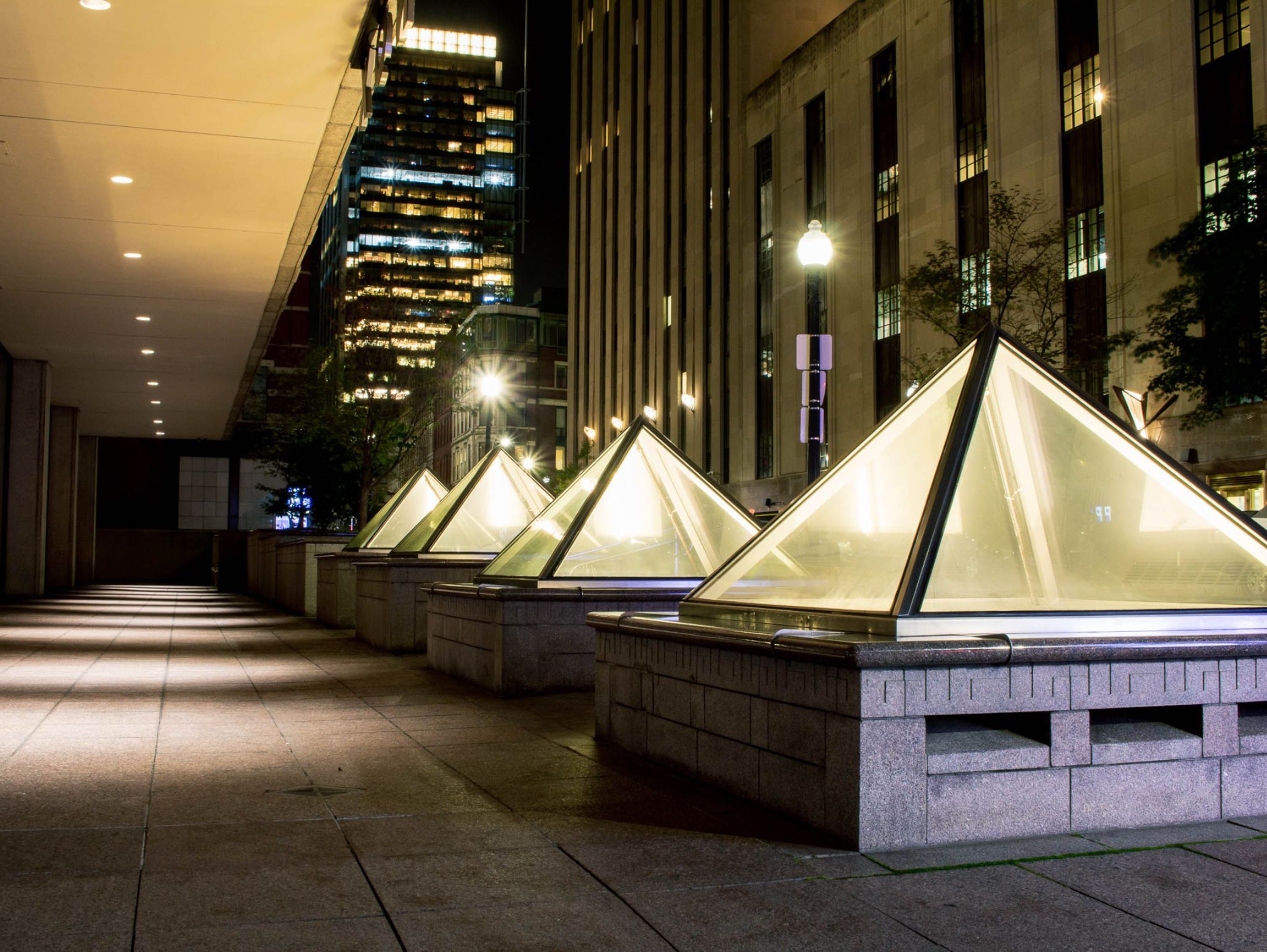 Modern urban architecture night scene with pyramids · Free Stock Photo
