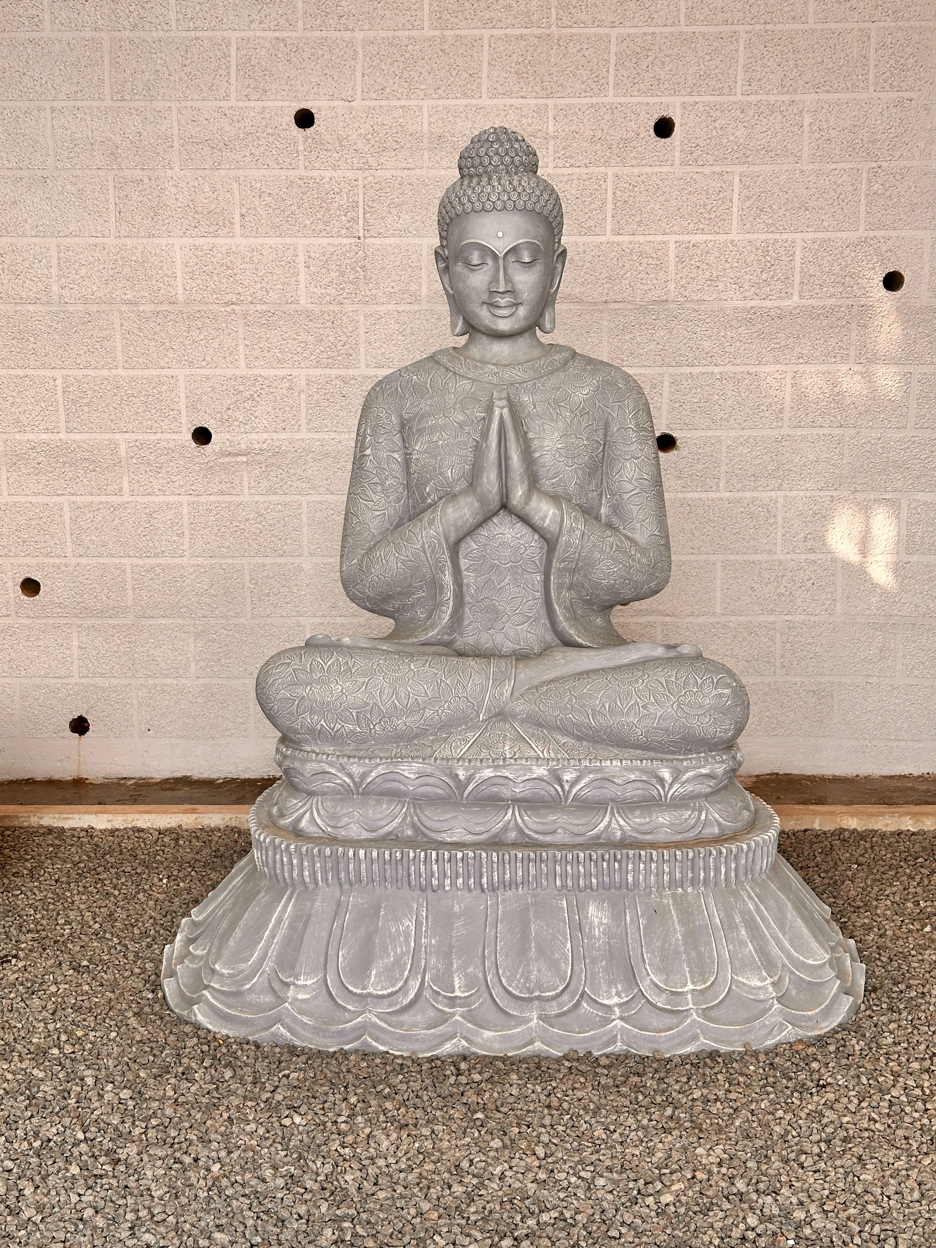 Serene Stone Buddha Statue in Meditation Pose · Free Stock Photo