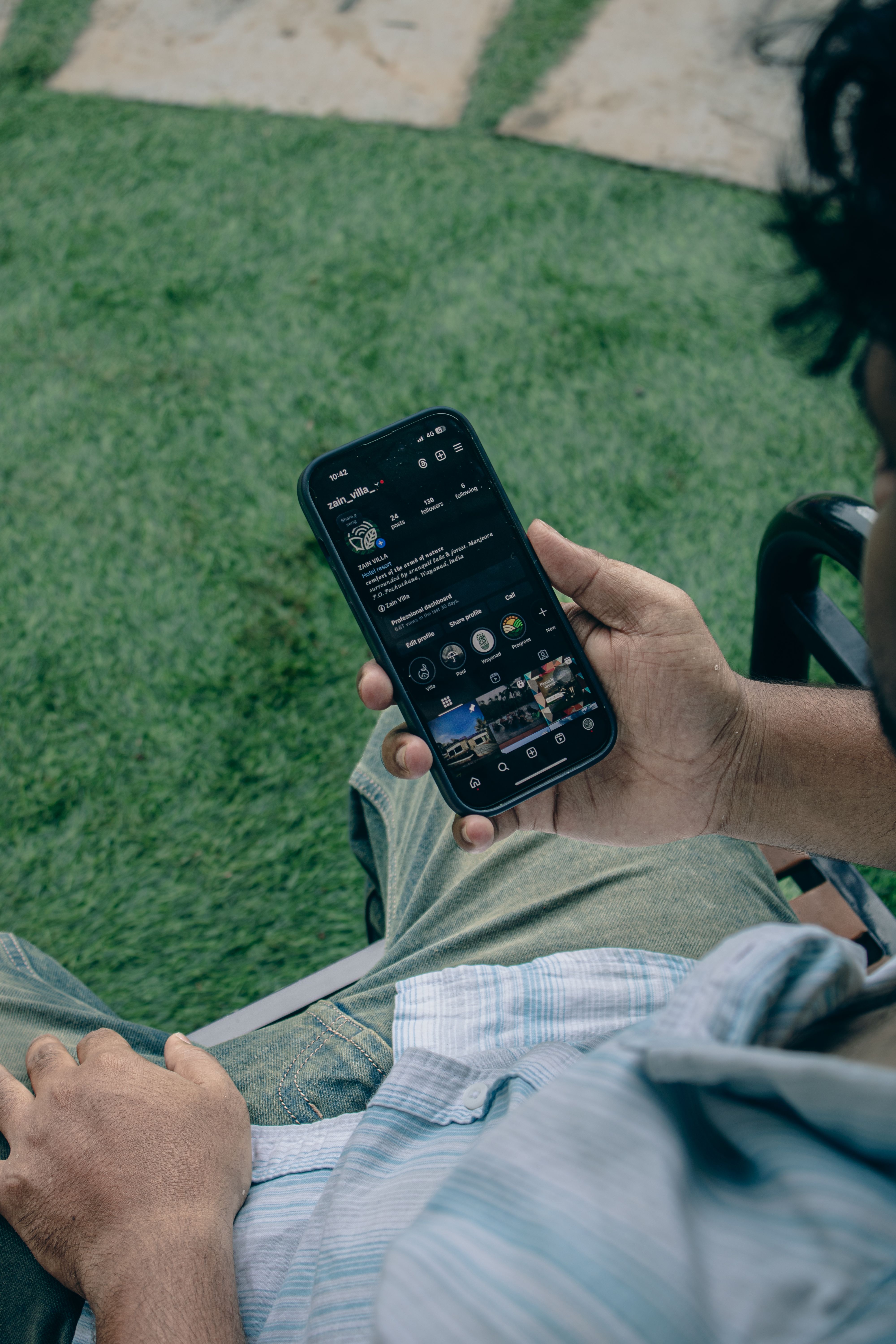Person Browsing Social Media on Smartphone Outdoors · Free Stock Photo