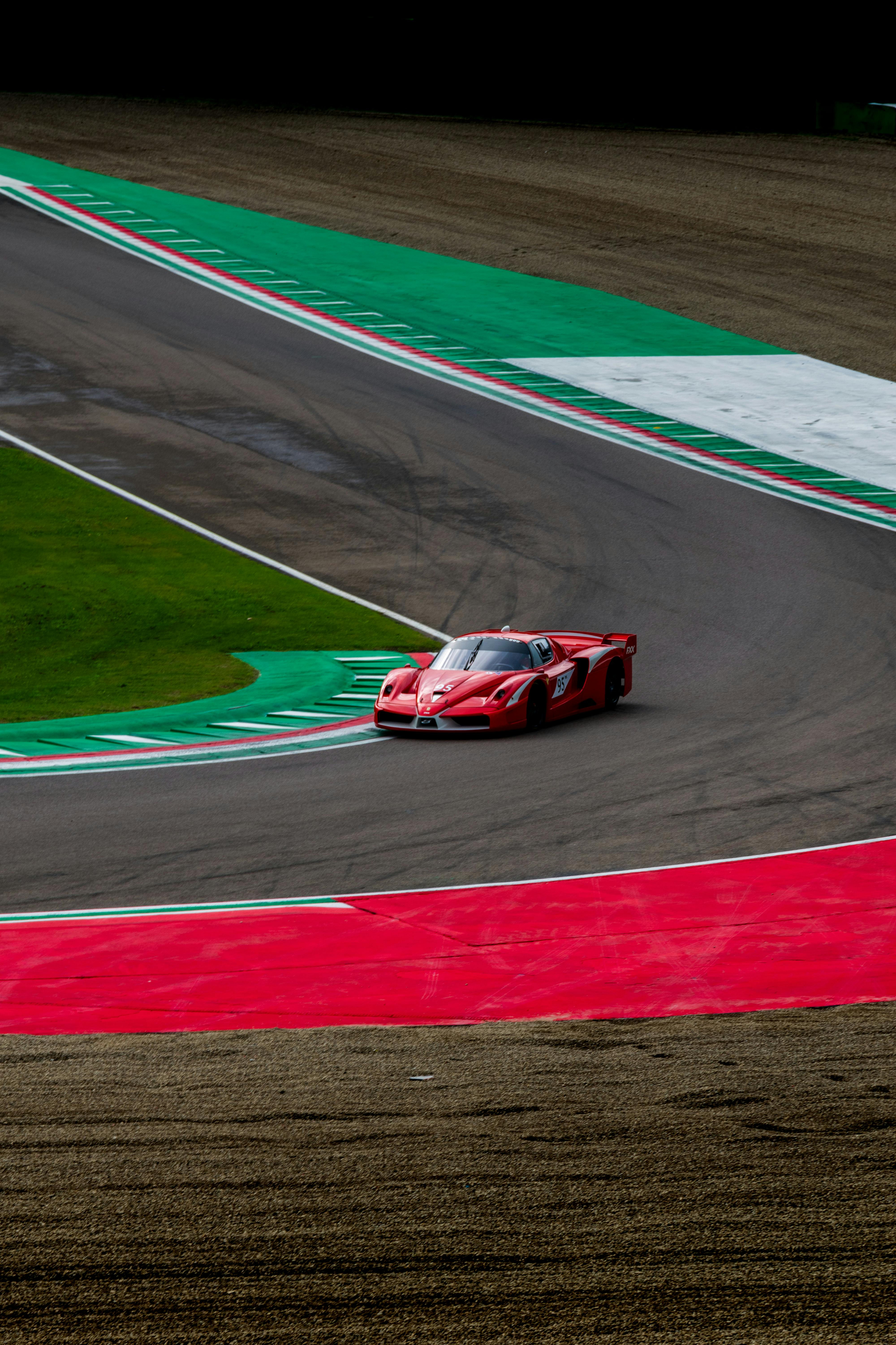 Red Sports Car on a Racing Track at Daytime · Free Stock Photo