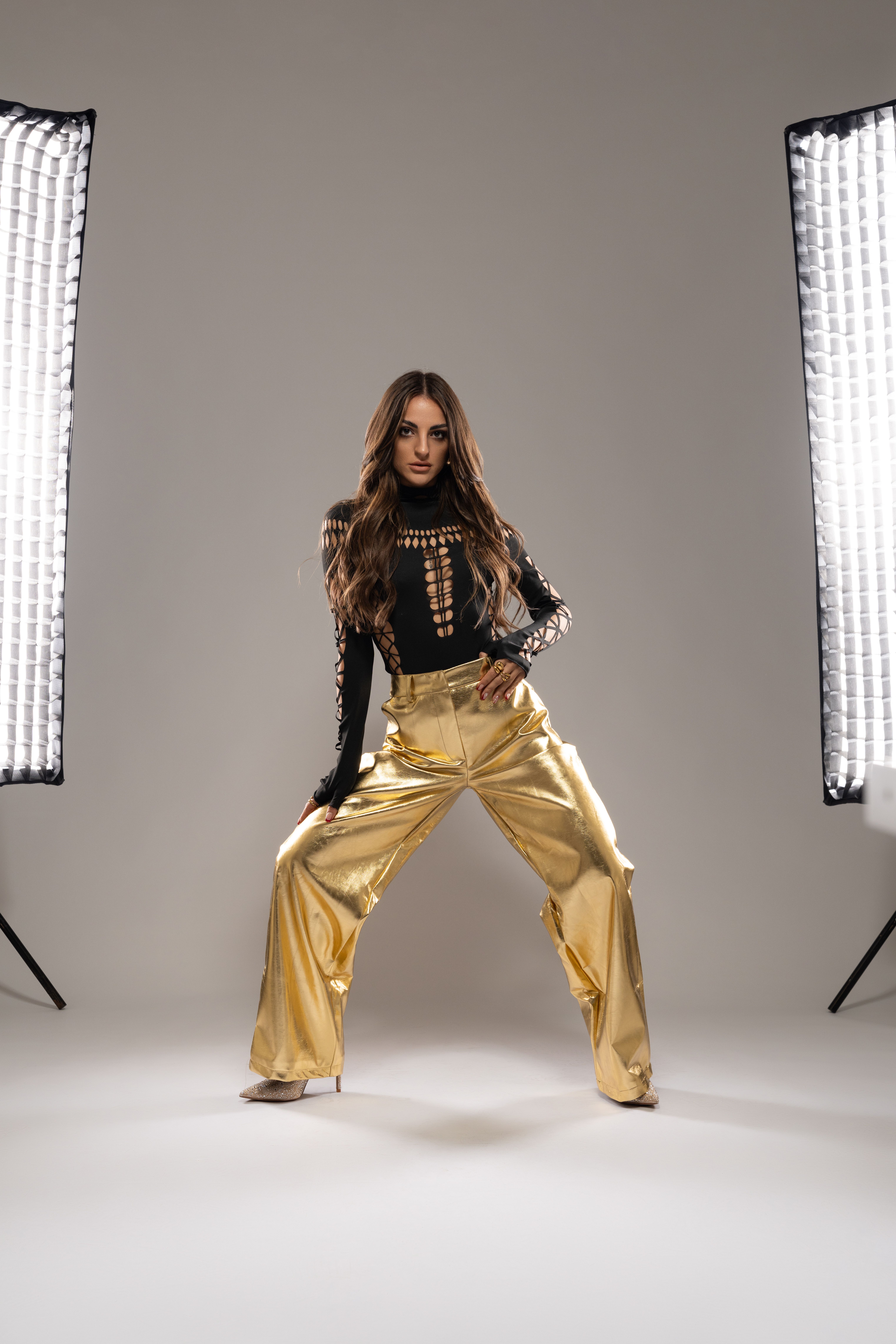 Fashion Model in Golden Trousers Studio Shoot · Free Stock Photo
