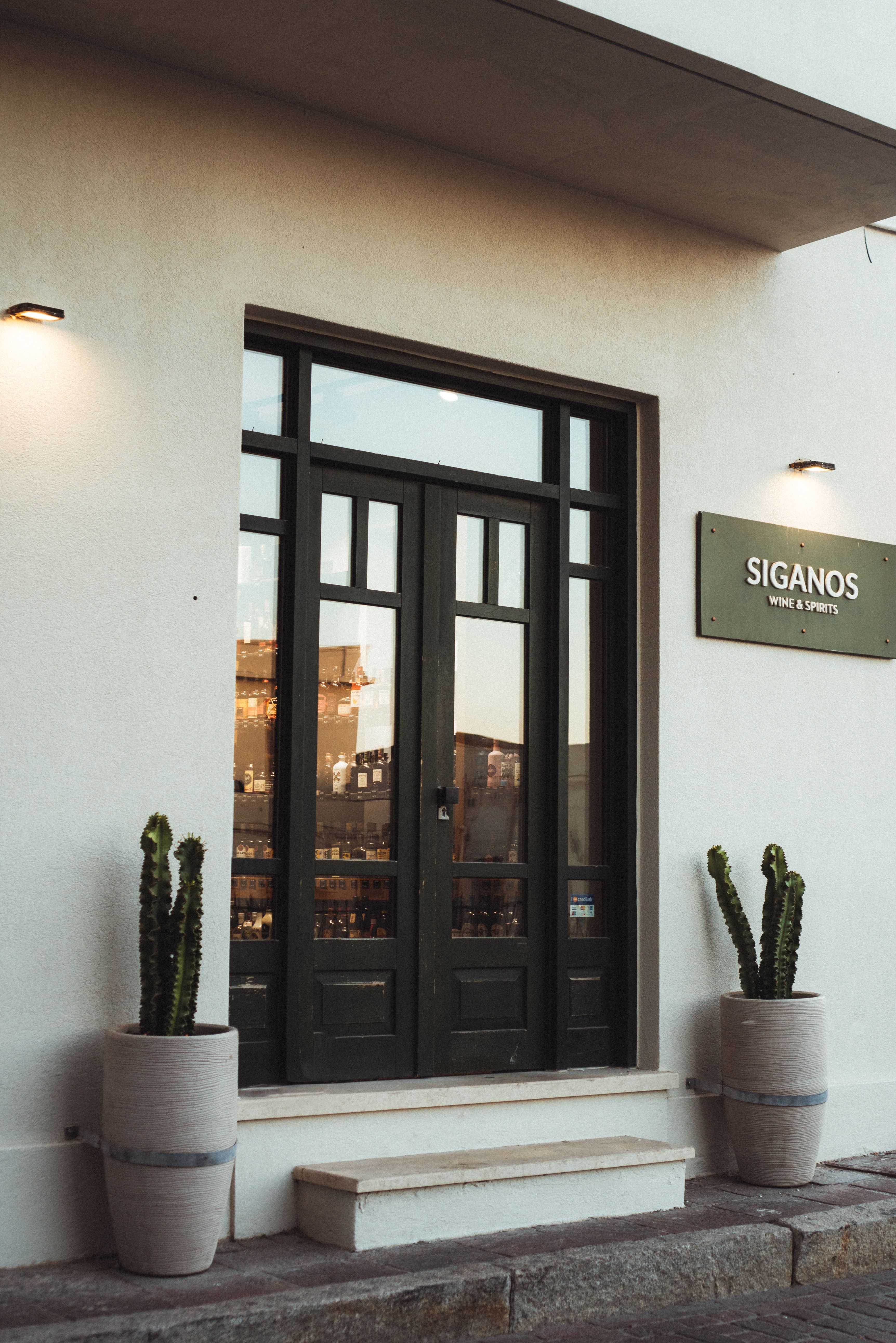 Elegant Wine & Spirits Storefront Exterior · Free Stock Photo