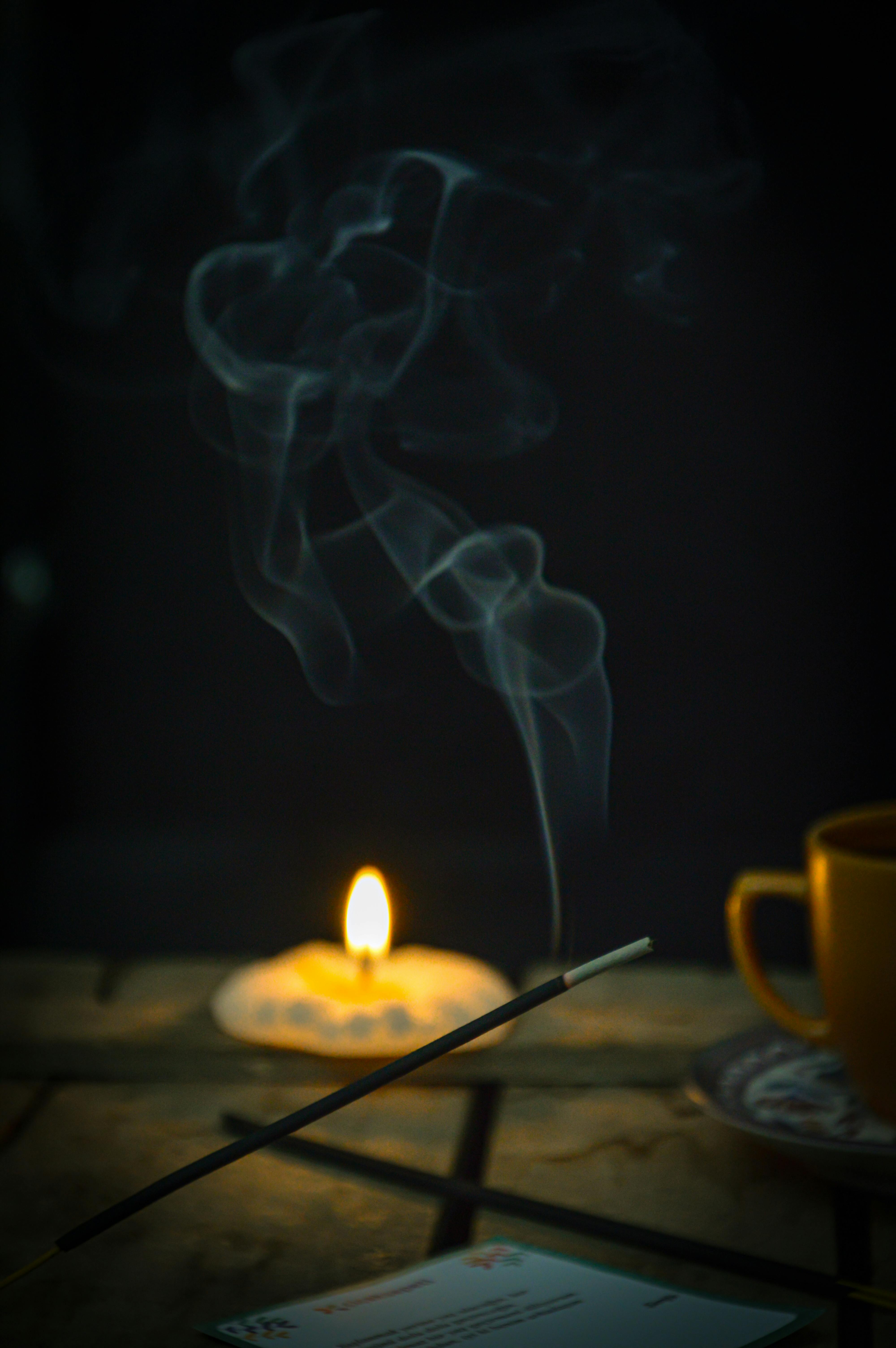 Cozy Candlelit Scene with Incense and Tea · Free Stock Photo