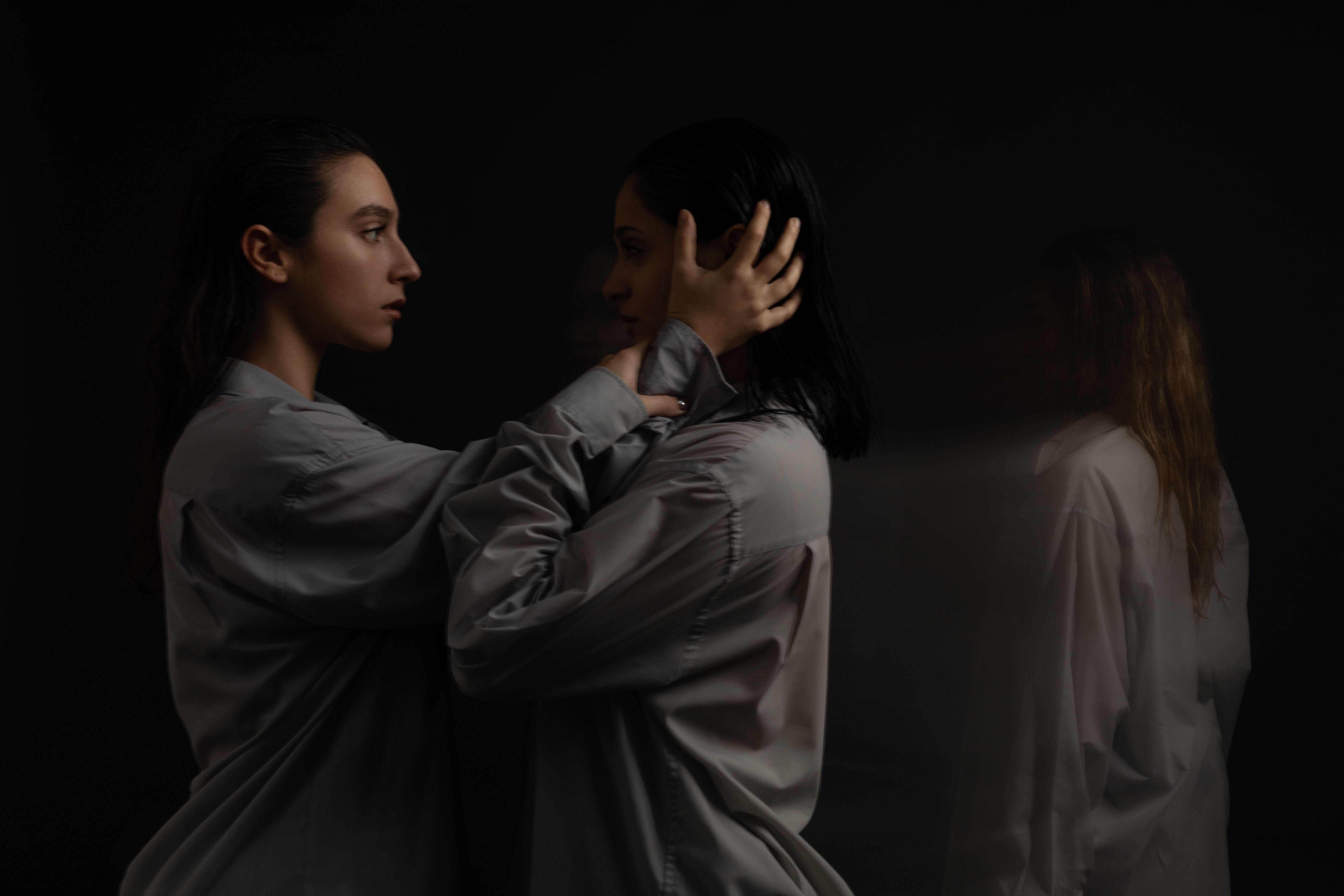 Emotional Portrait of Two Women in Dramatic Light · Free Stock Photo