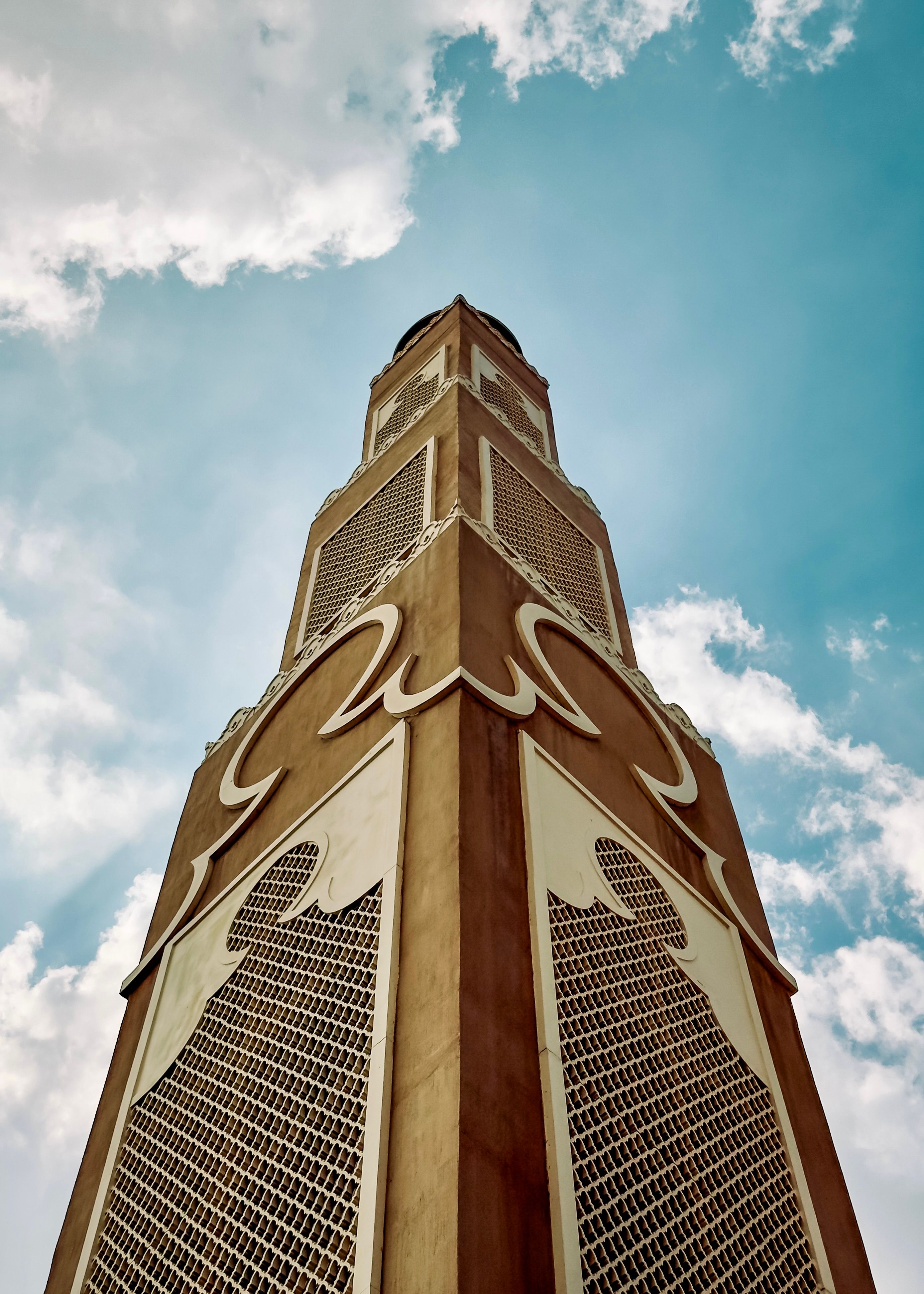 Architectural Tower Against a Blue Sky · Free Stock Photo