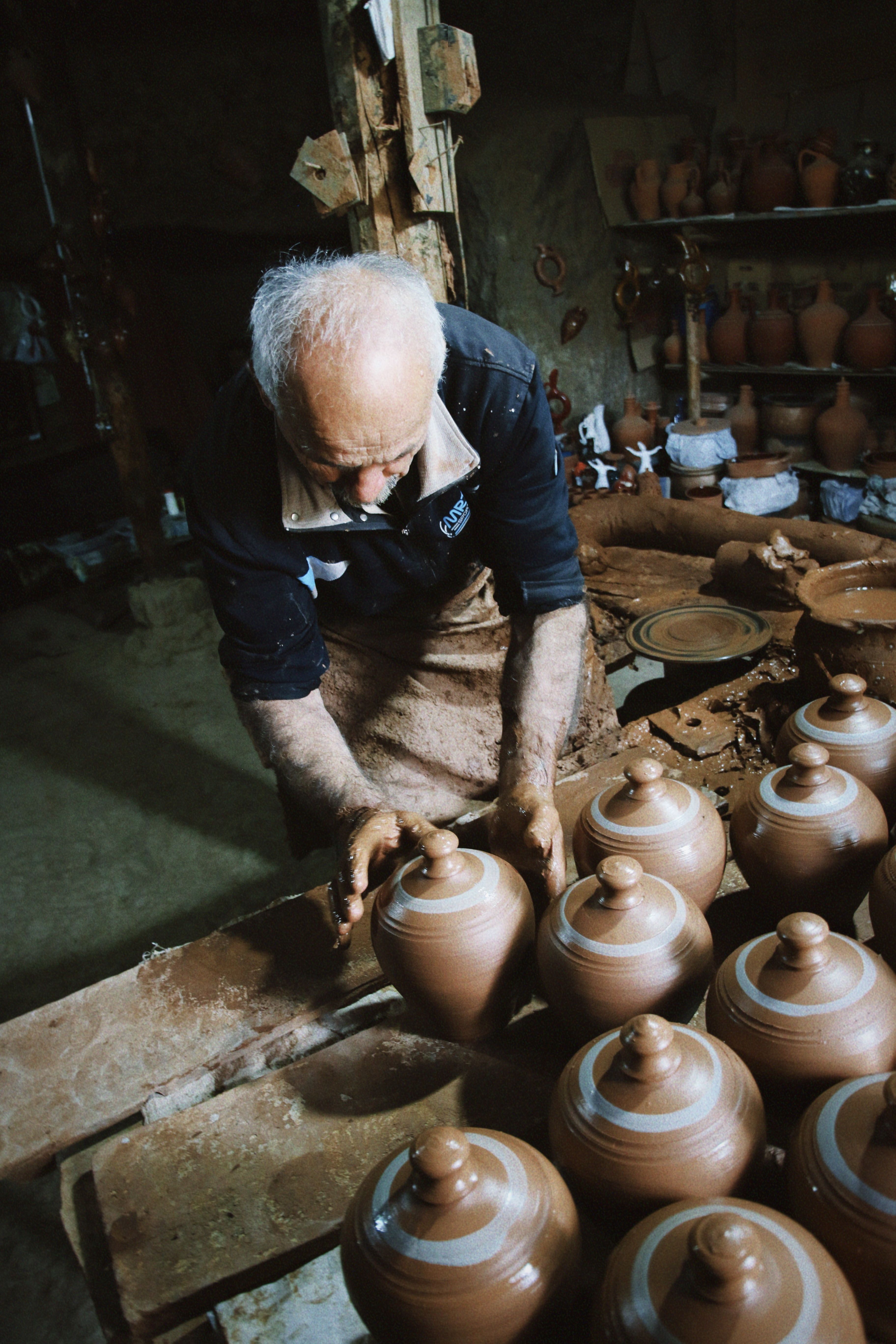 Skilled Potter Crafting Ceramic Pots in Workshop · Free Stock Photo