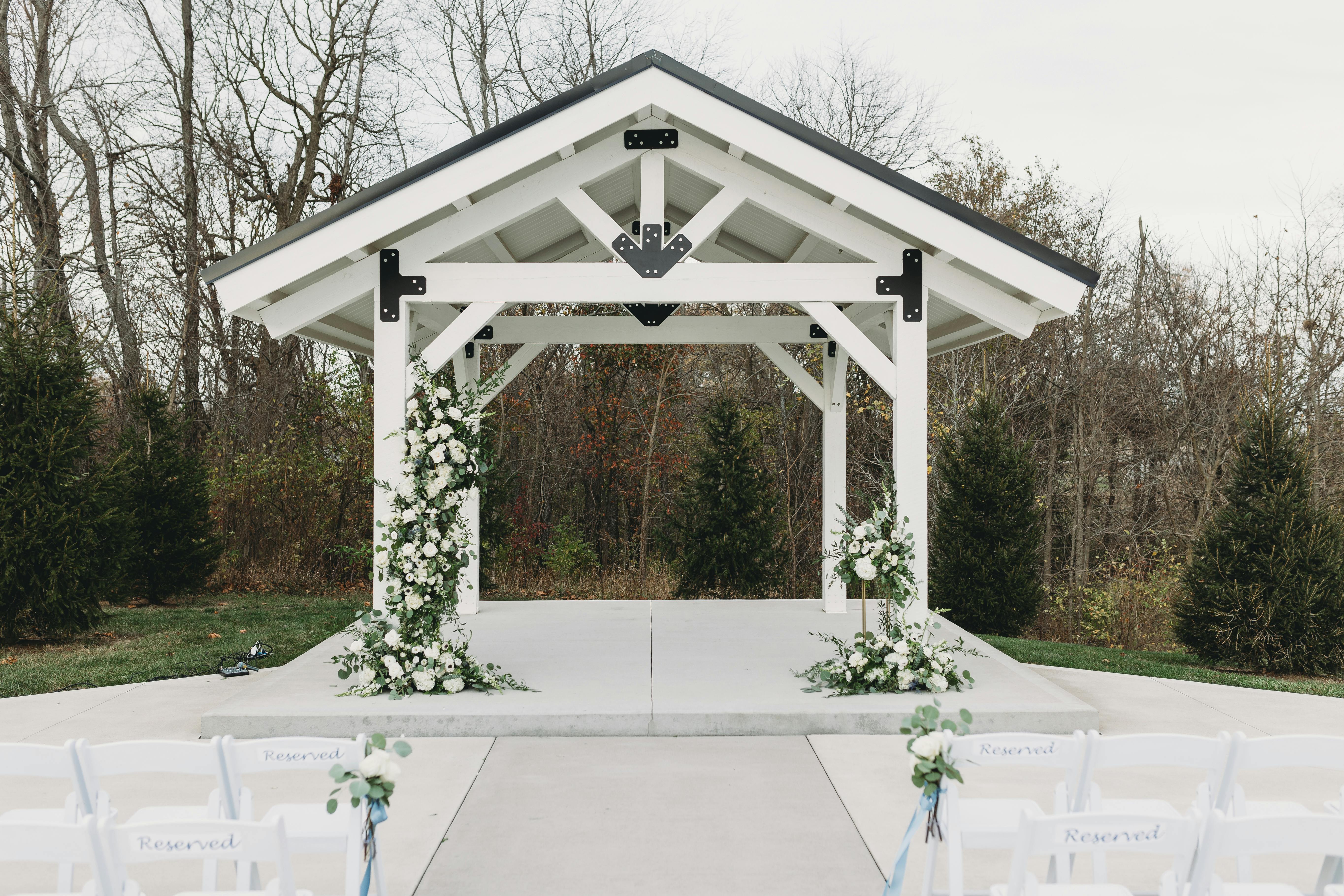 Elegant Outdoor Wedding Ceremony Venue with Pavilion · Free Stock Photo