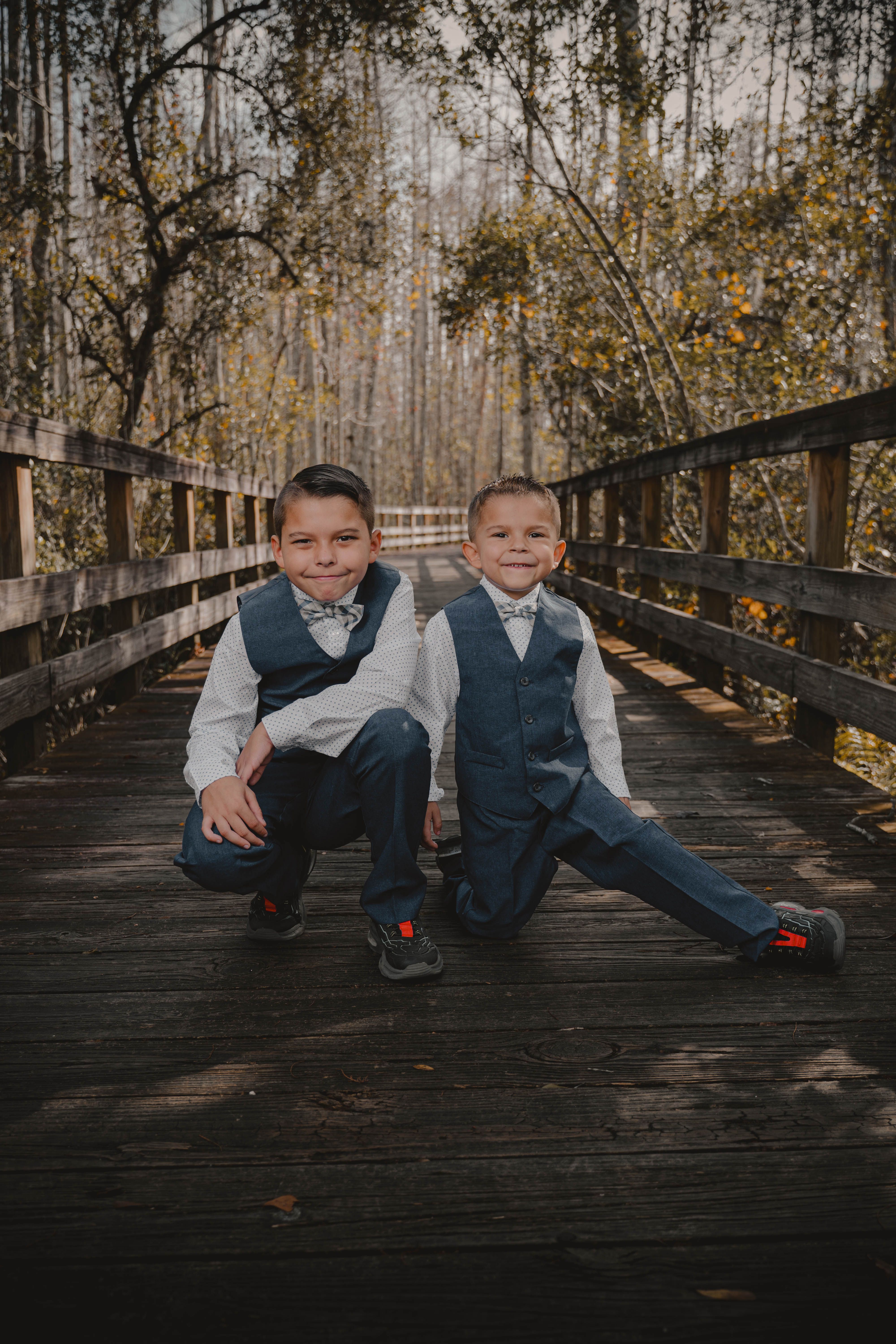 Boys in Formal Wear on Wooden Bridge Outdoors · Free Stock Photo