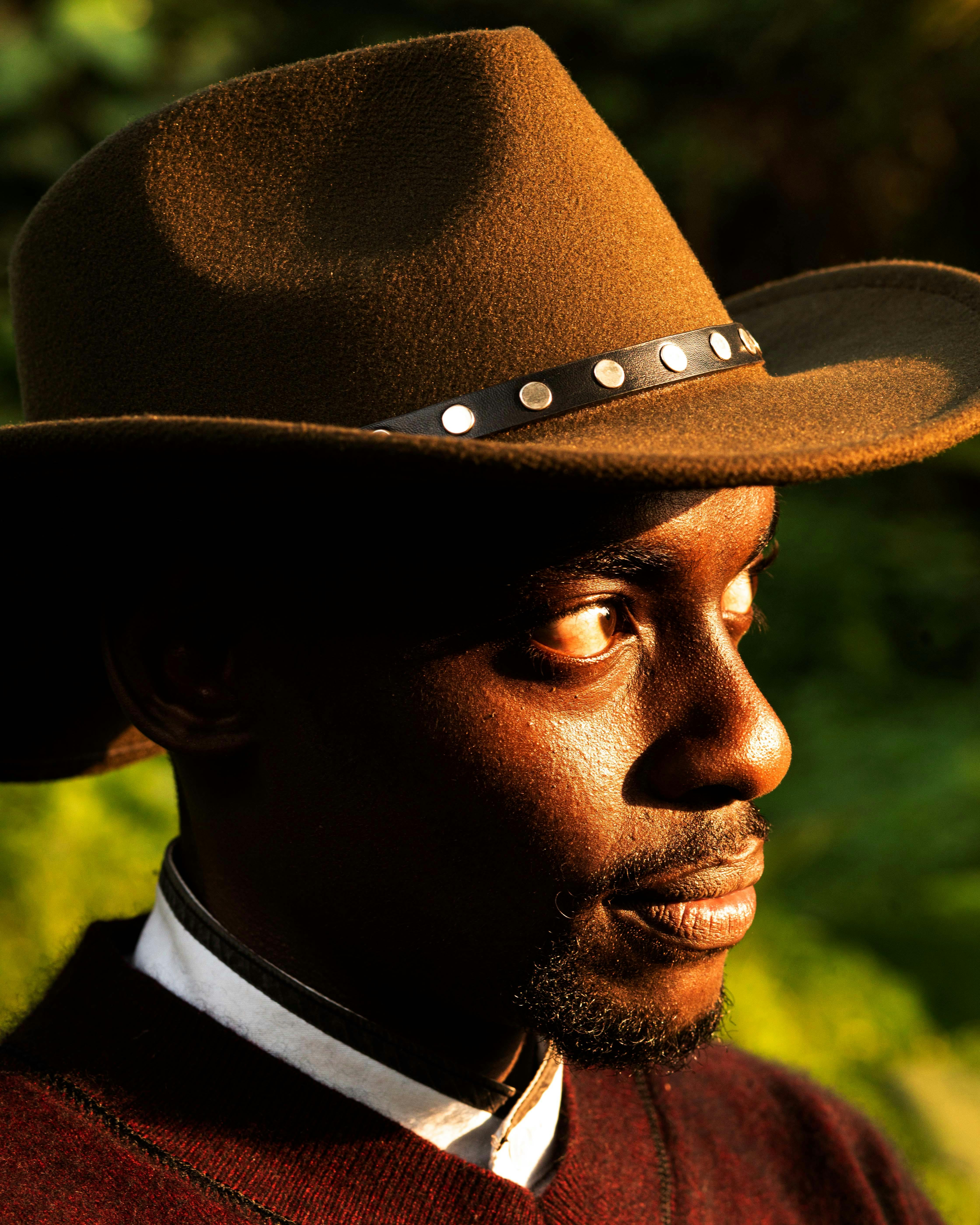Profile Portrait of Man in Cowboy Hat in Uganda · Free Stock Photo