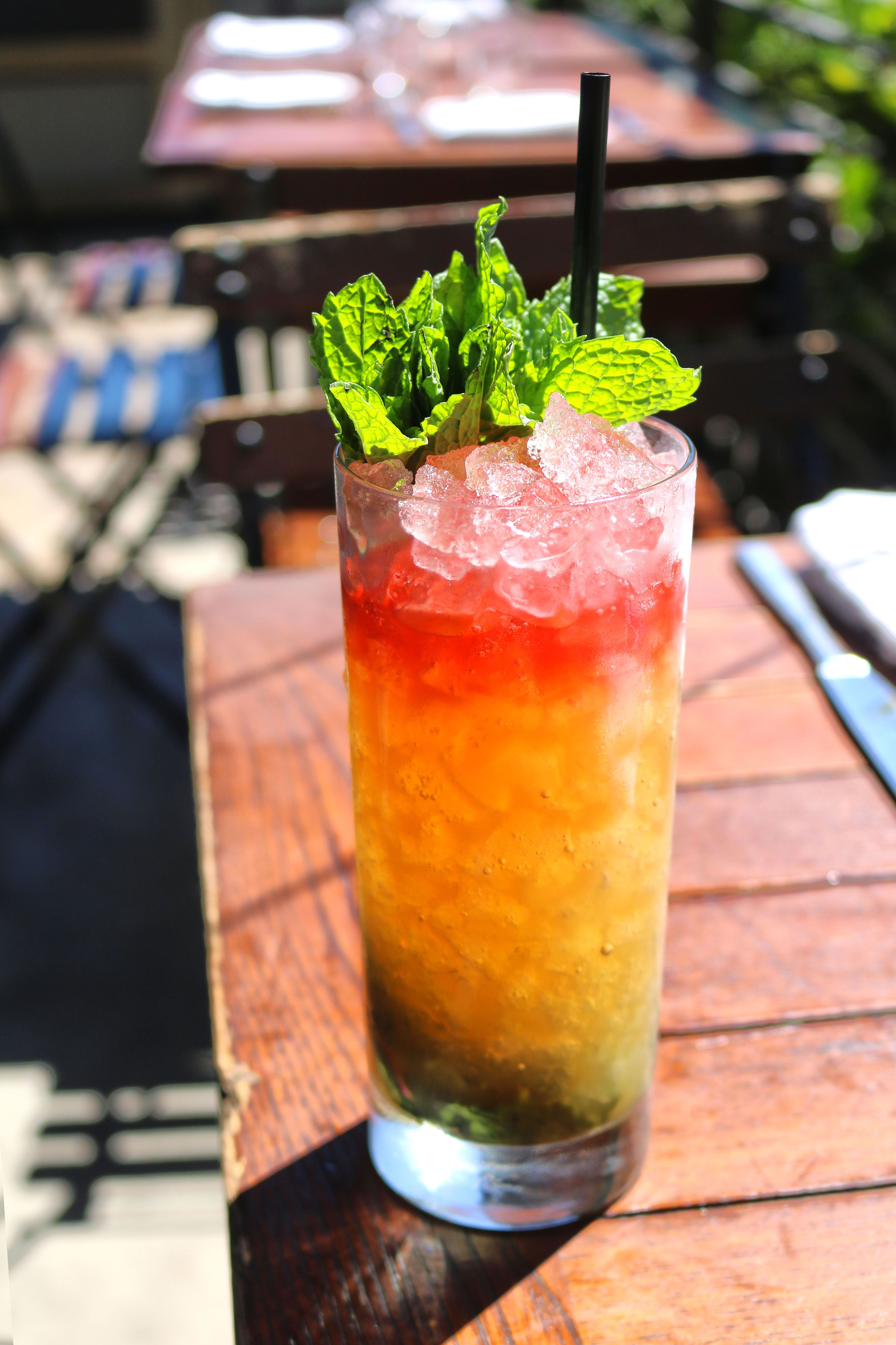 Refreshing Cocktail with Mint Garnish on Sunny Patio · Free Stock Photo