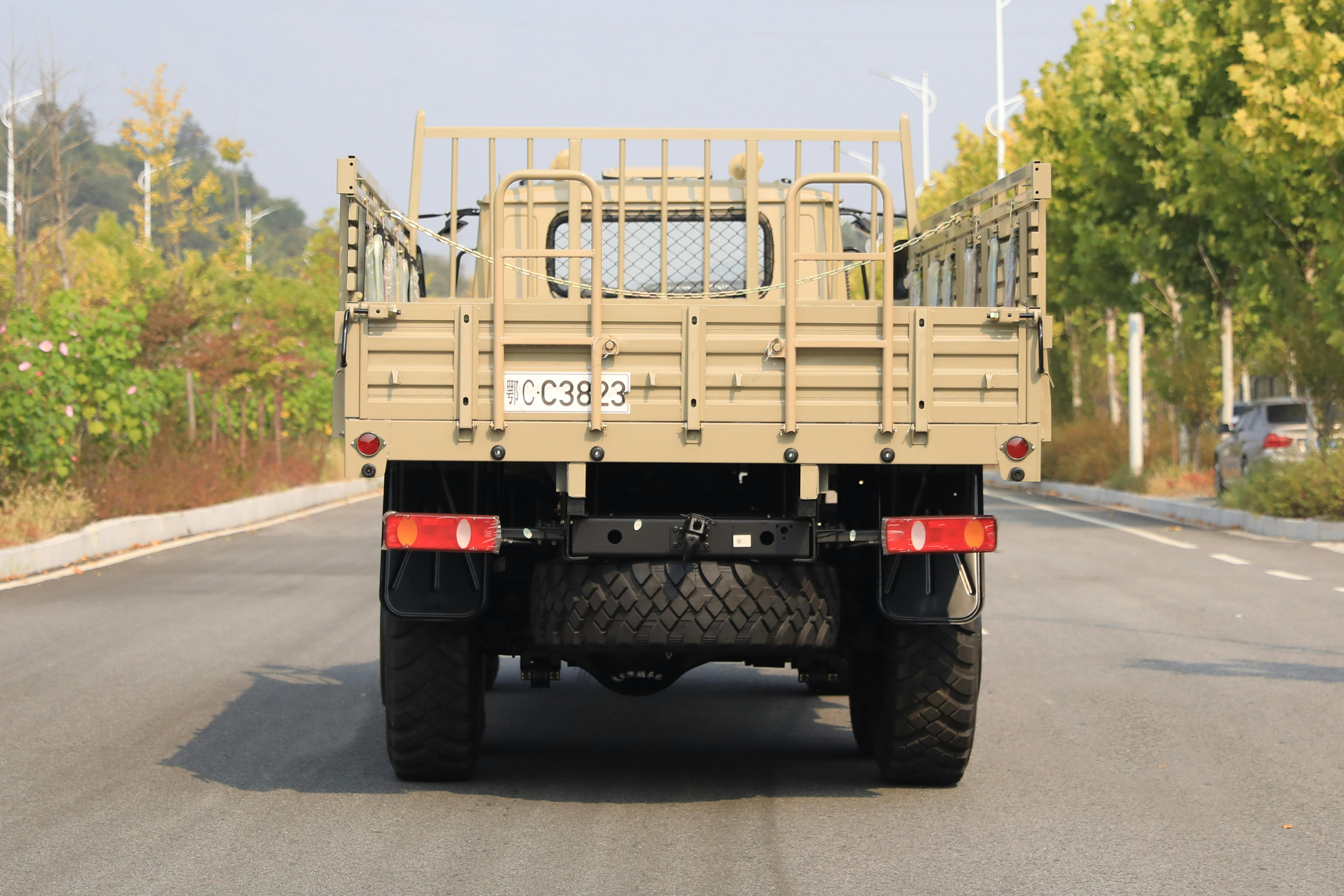 Rear View of Military Transport Vehicle on Road · Free Stock Photo
