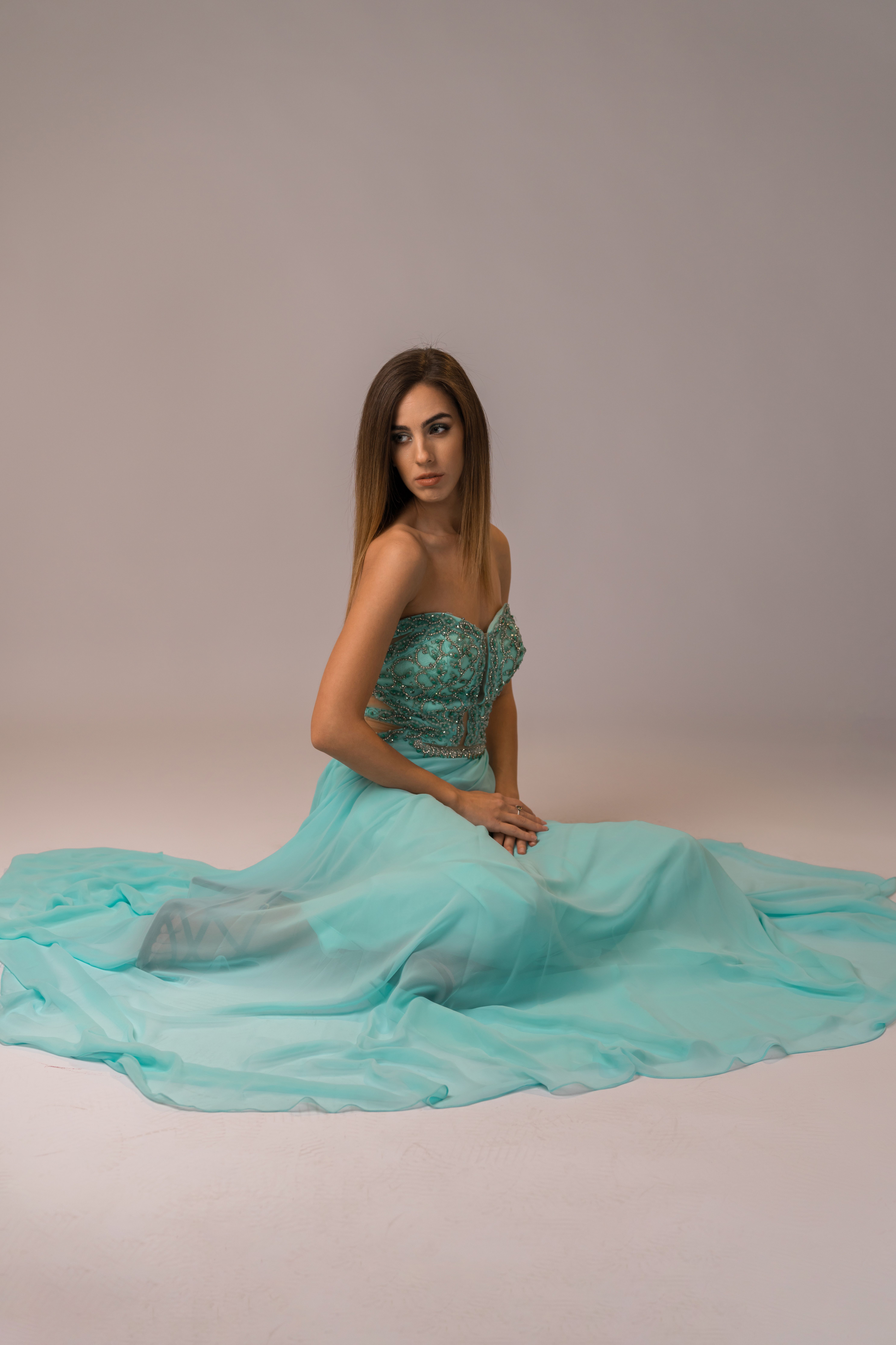 Elegant Woman in Turquoise Evening Gown · Free Stock Photo