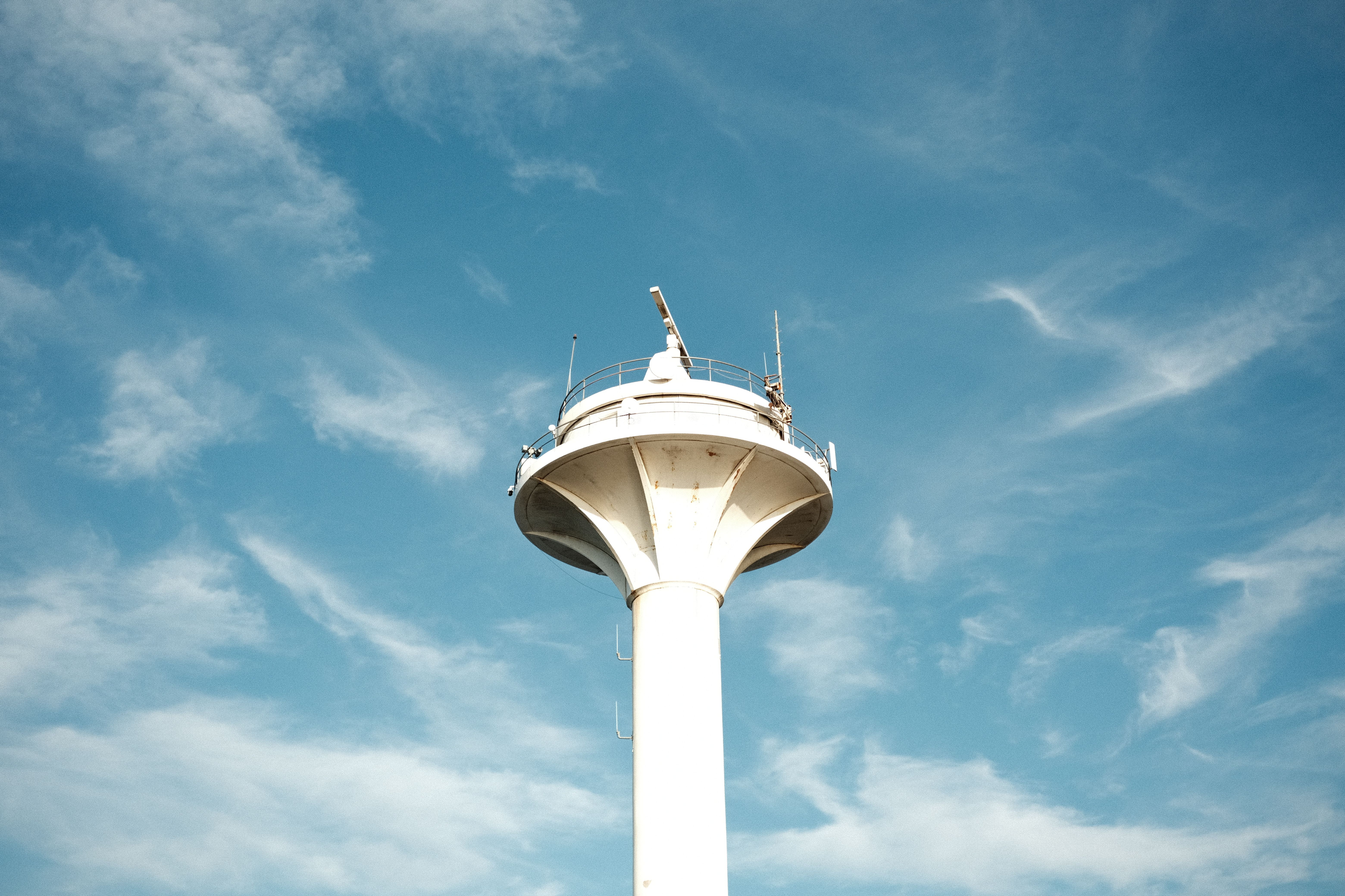 Modern Water Tower Against Clear Blue Sky · Free Stock Photo