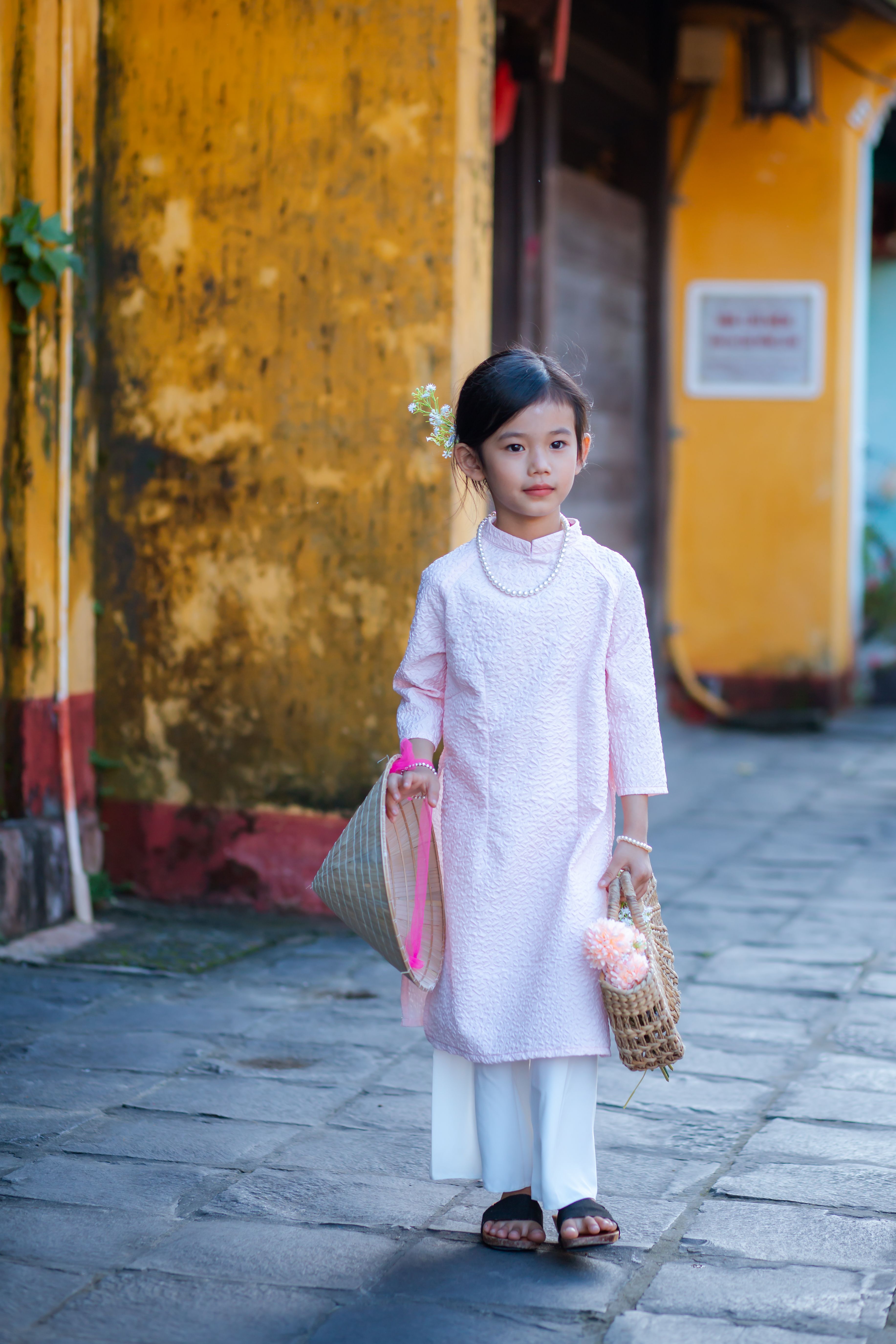 Young Girl in Traditional Ao Dai in Hội An · Free Stock Photo