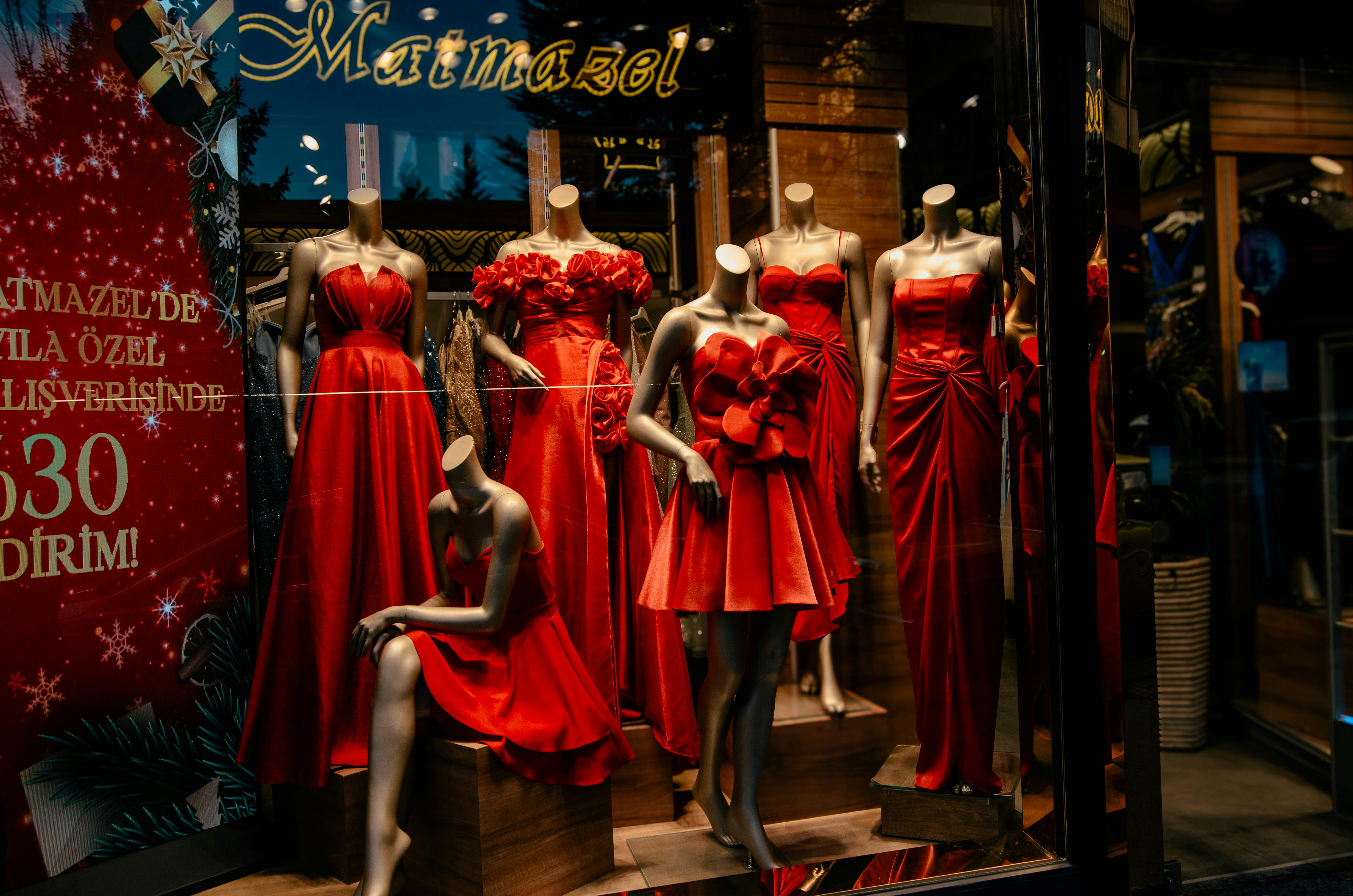 Festive Red Dresses Display in Holiday Storefront · Free Stock Photo