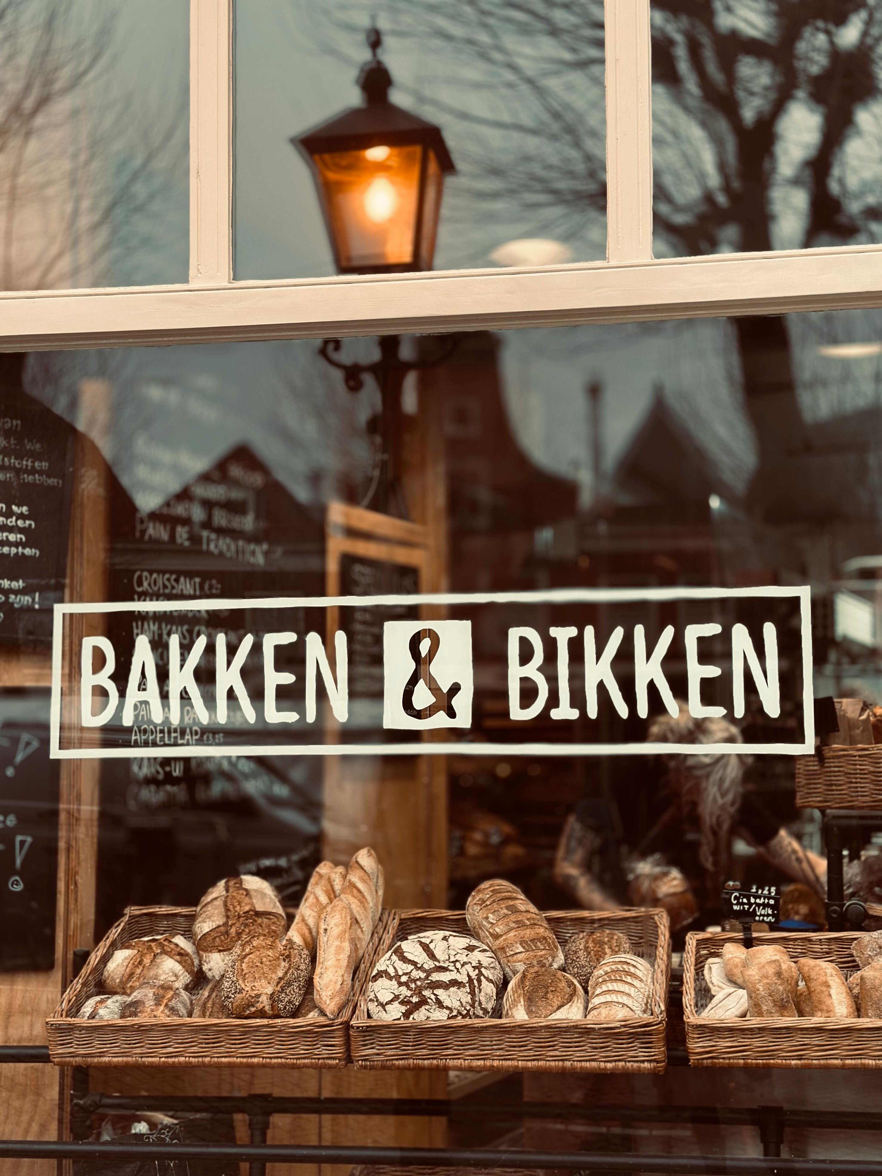 Cozy Bakery Window Display with Fresh Bread · Free Stock Photo