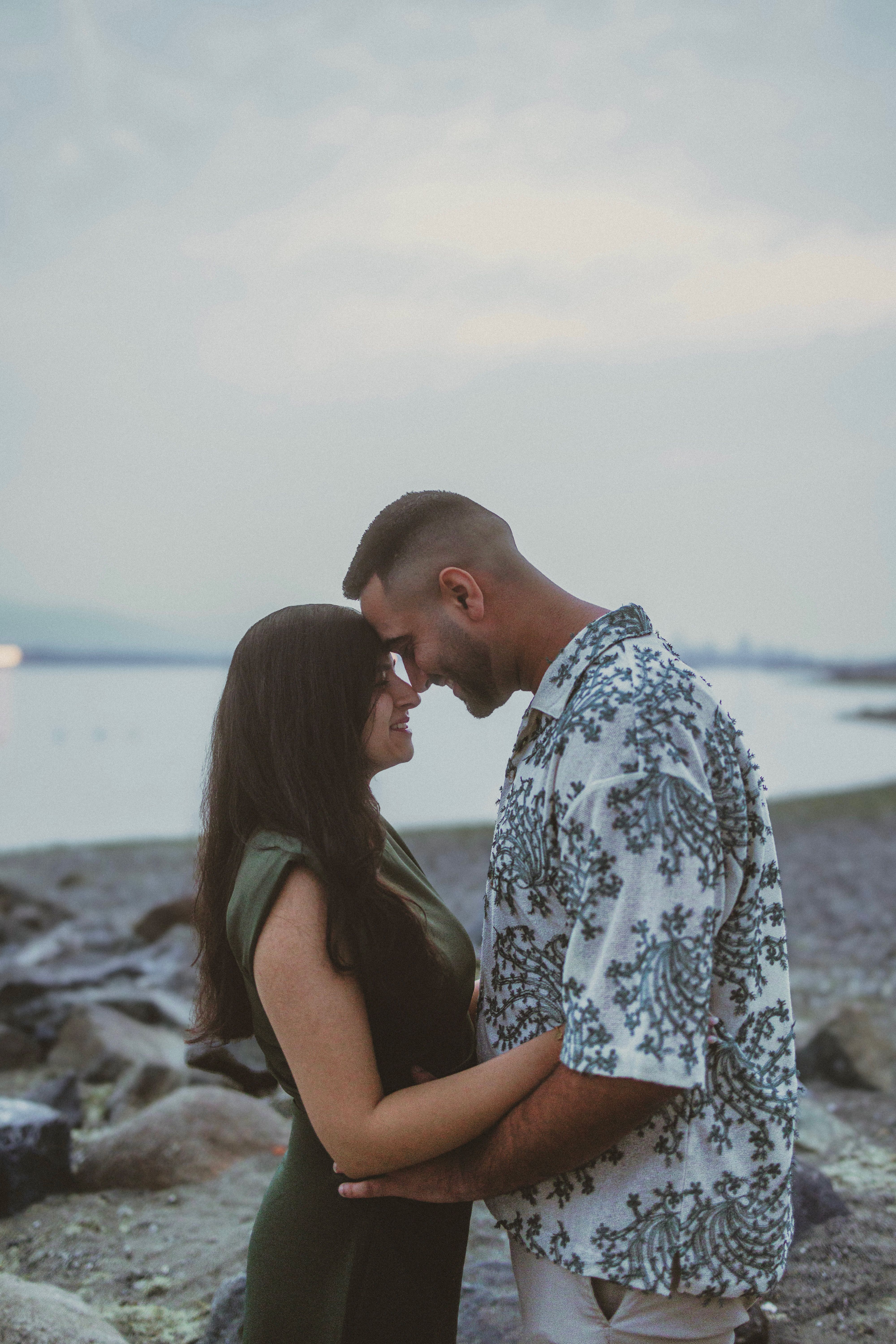 Romantic Couple Embracing on BC Beach · Free Stock Photo