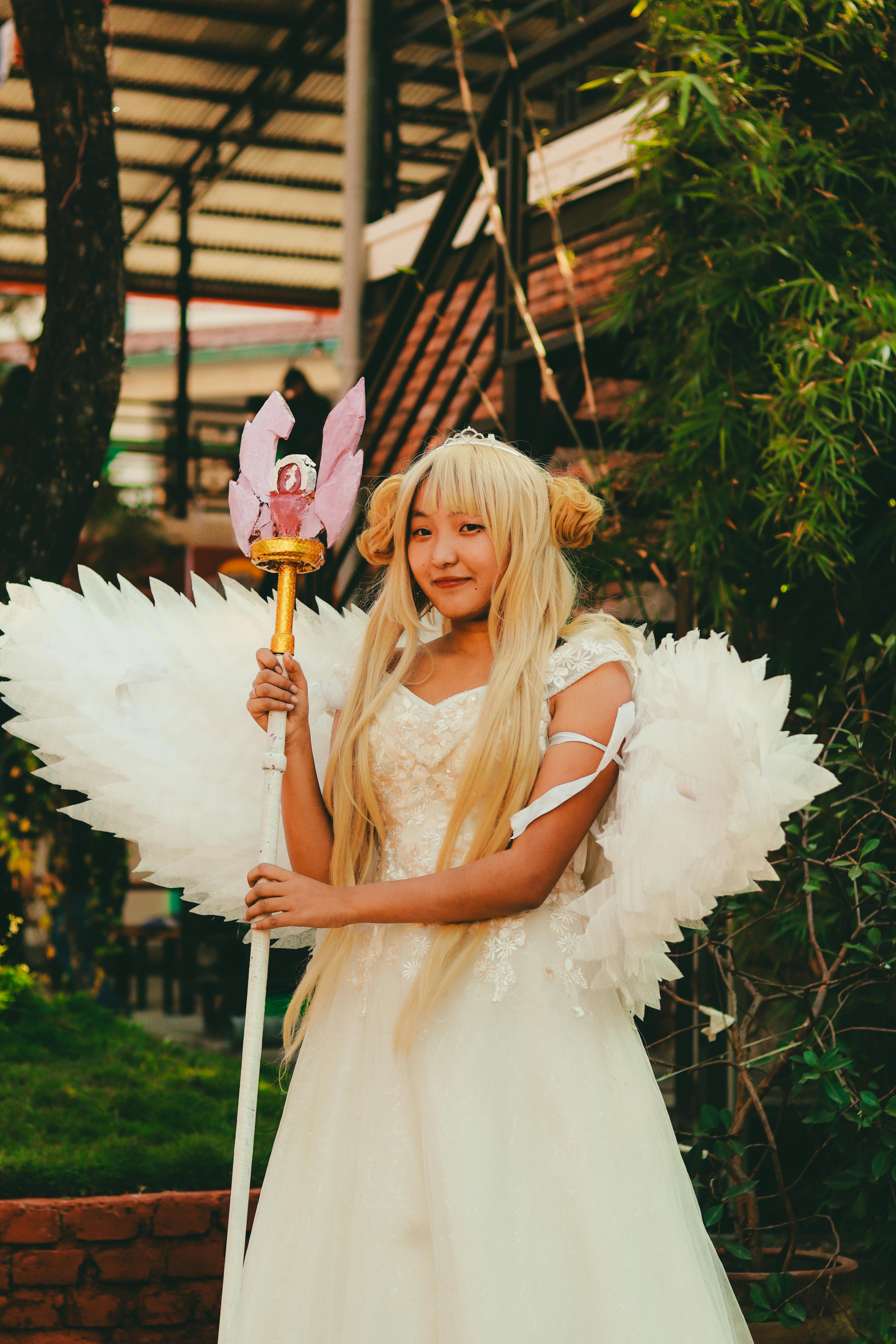 Cosplayer in Angelic Outfit Posing Outdoors · Free Stock Photo