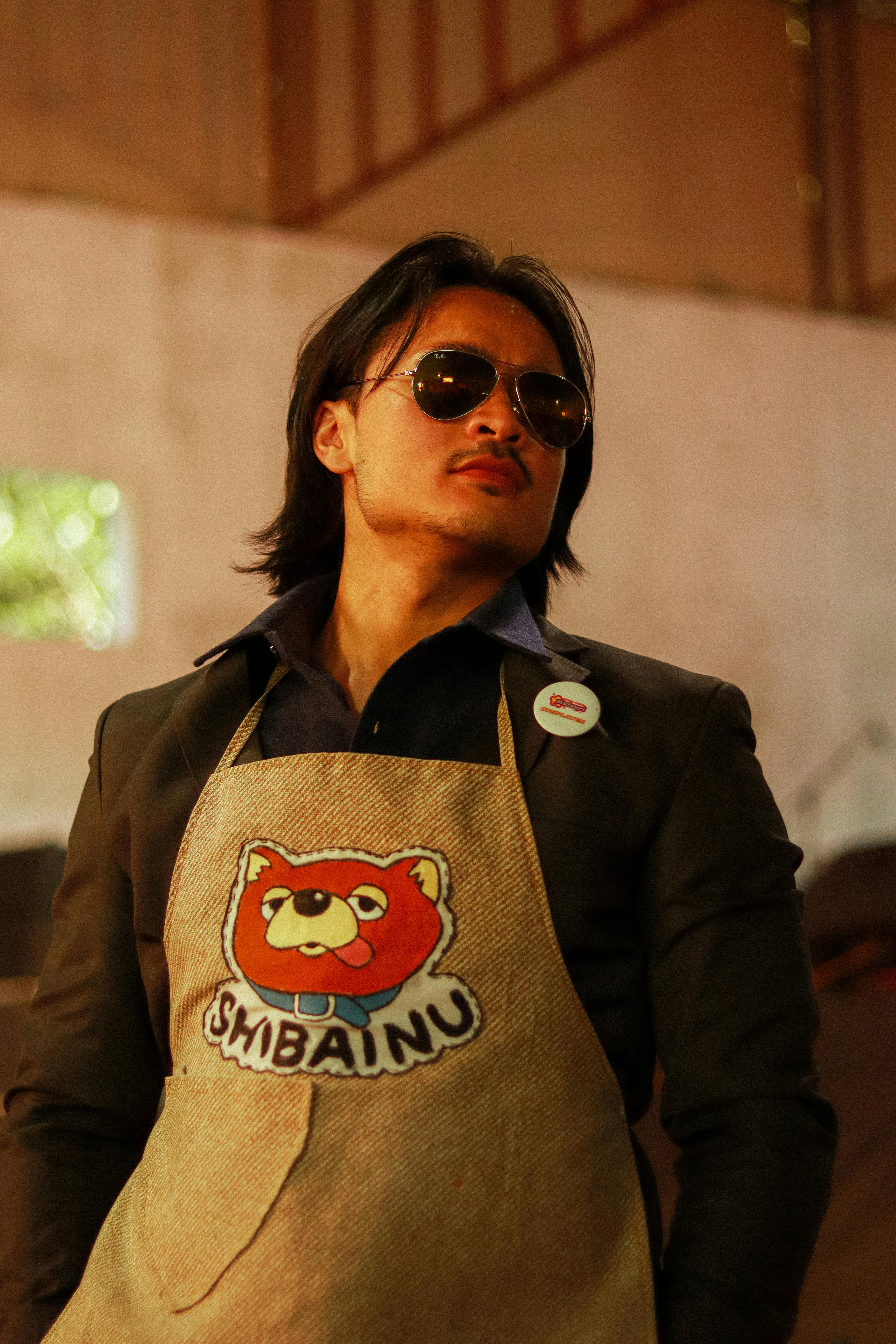 Confident Person Wearing Shiba Inu Apron · Free Stock Photo