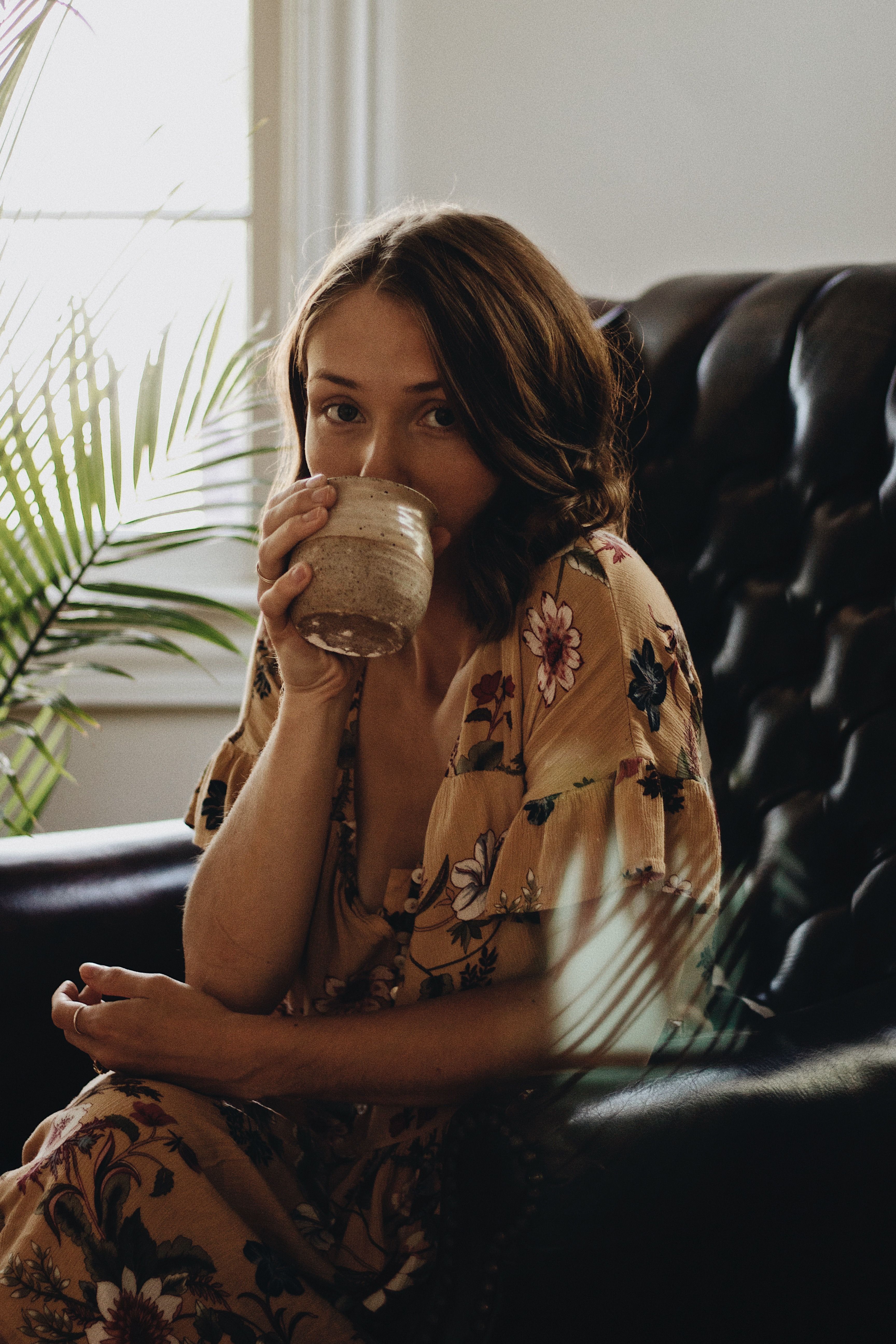 Relaxed Woman Sipping Coffee in Cozy Room · Free Stock Photo