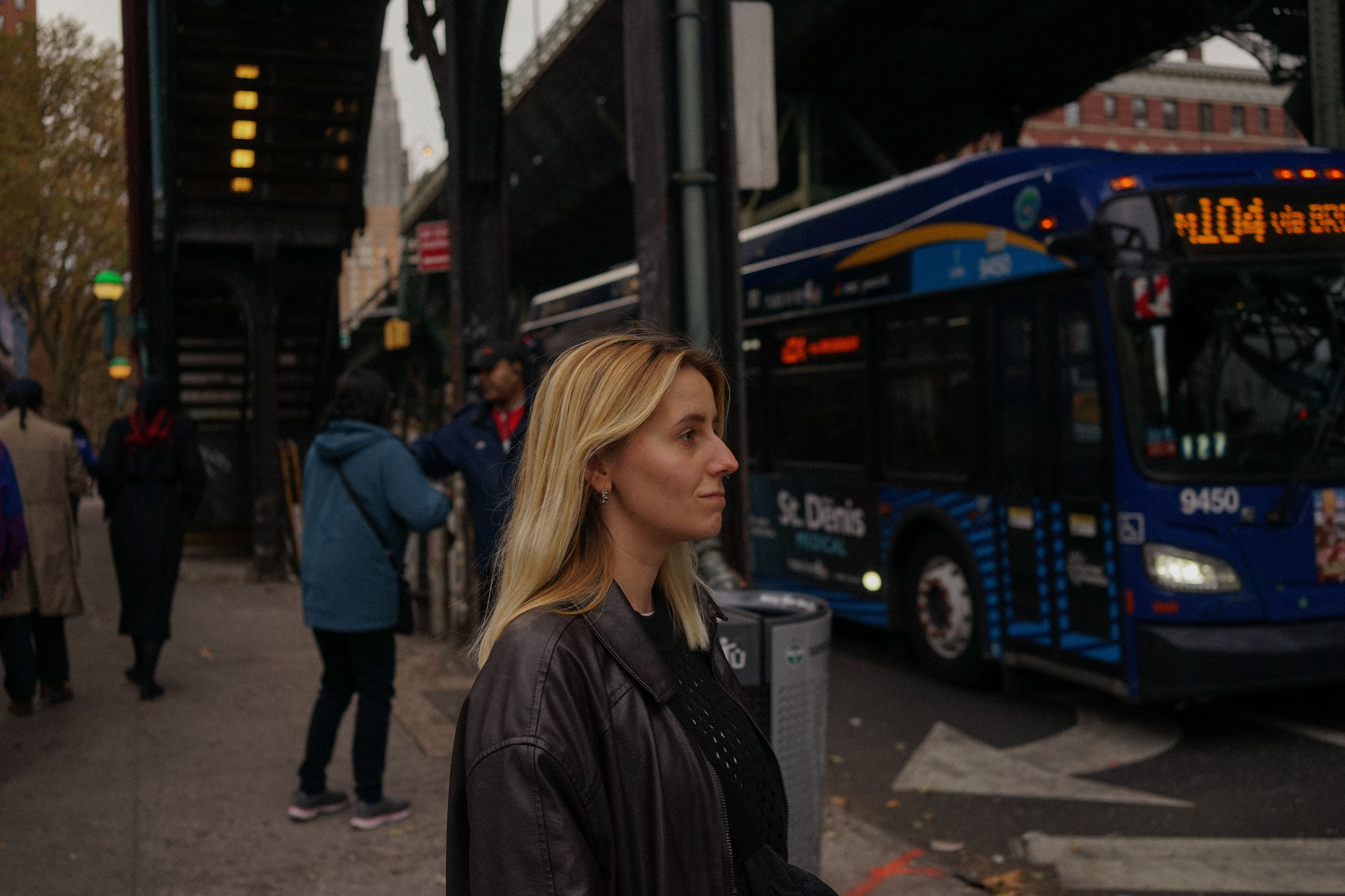 Urban scene with public transportation and pedestrians · Free Stock Photo