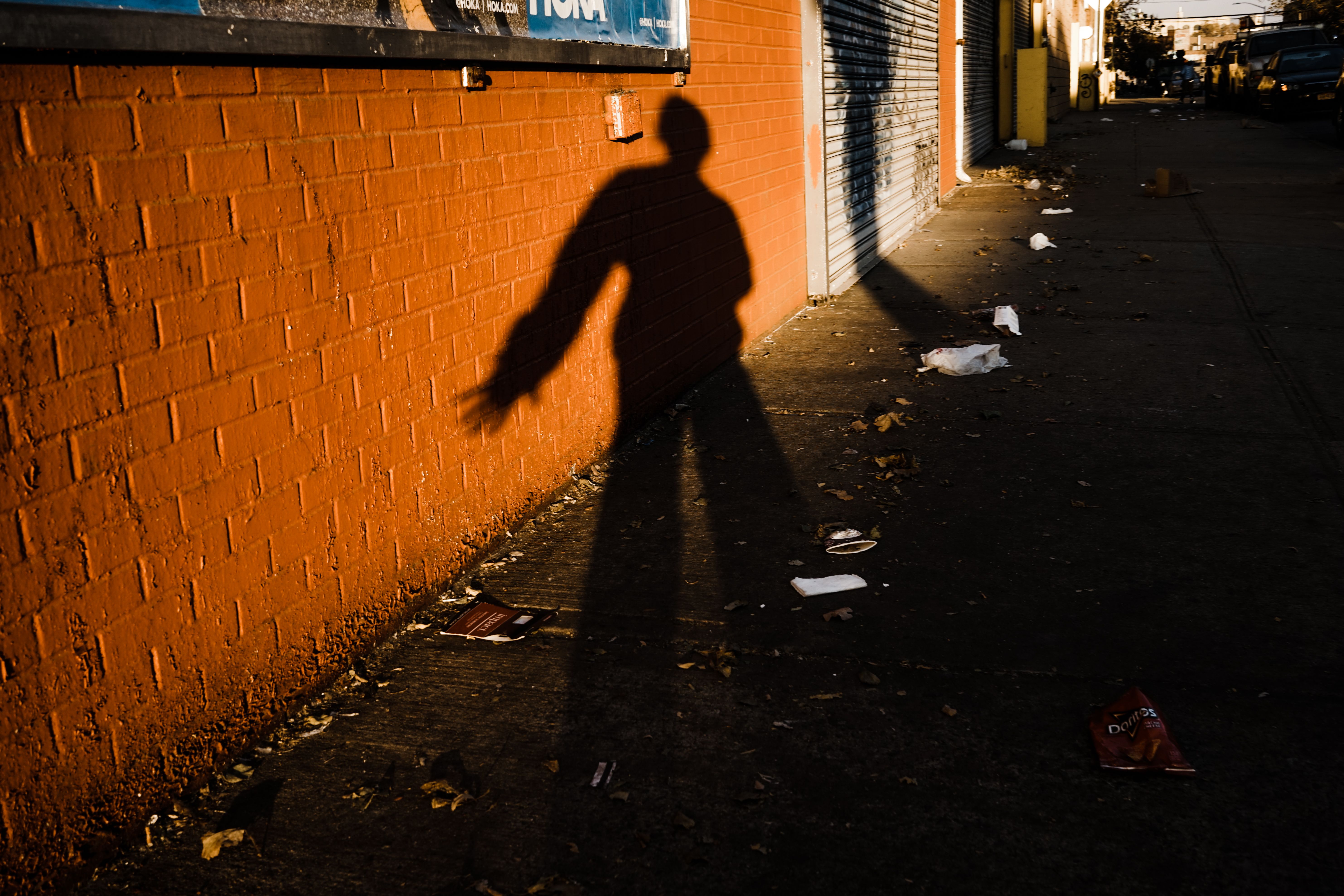 Urban Shadow Silhouette on Brick Wall · Free Stock Photo