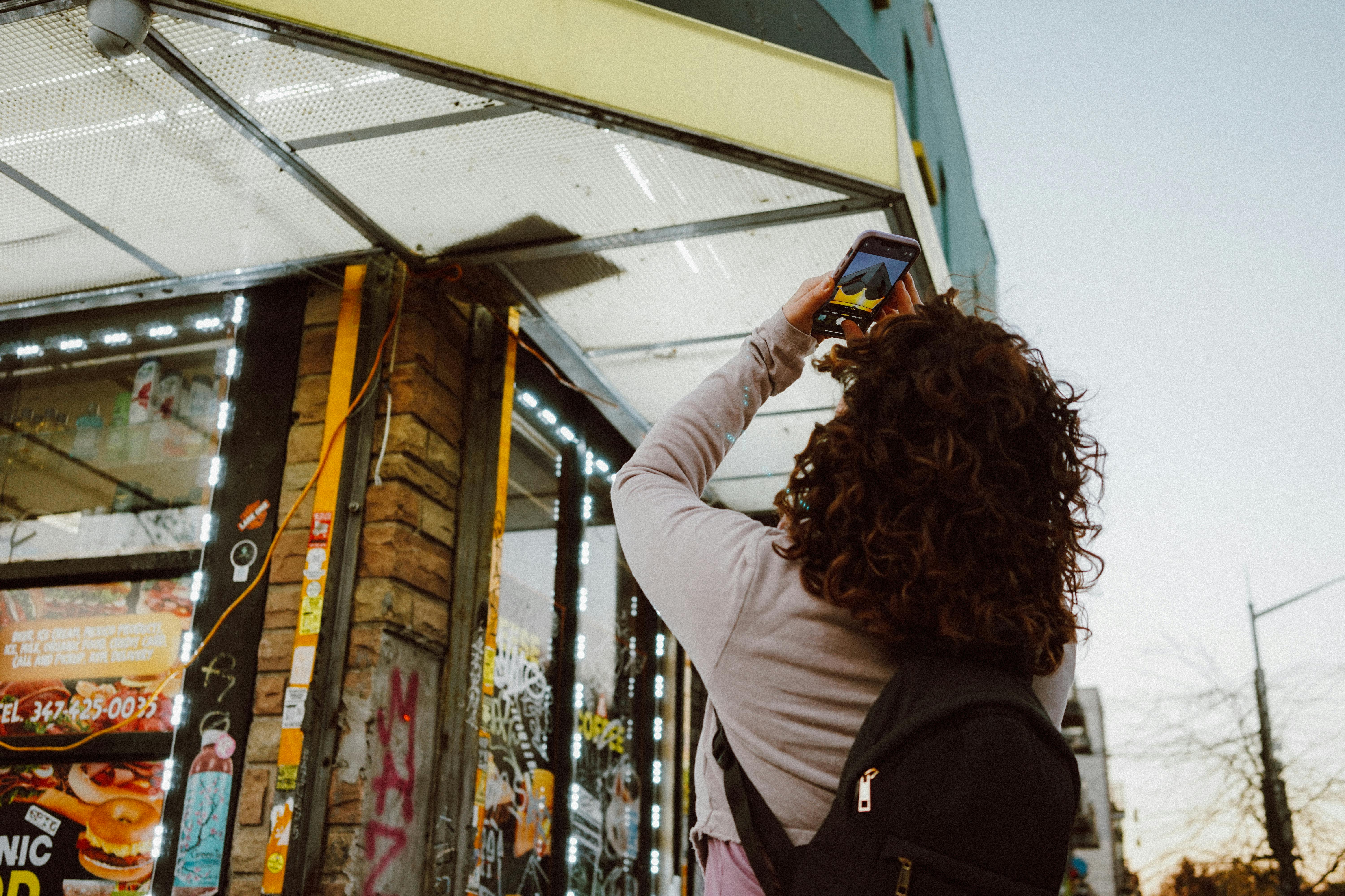 Urban Exploration: Capturing Street Art on Smartphone · Free Stock Photo