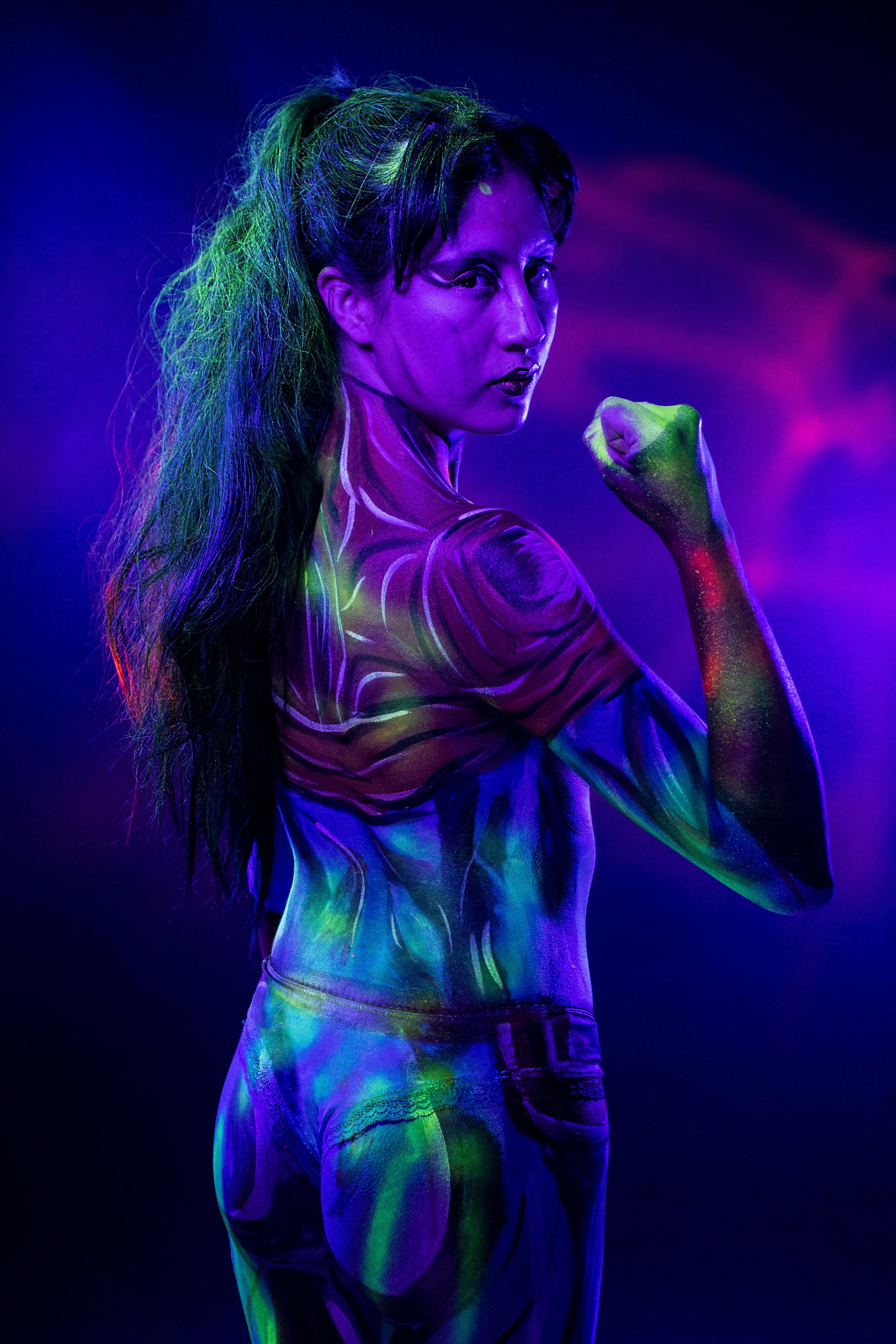 Vibrant Body Paint Art in Neon Lights · Free Stock Photo