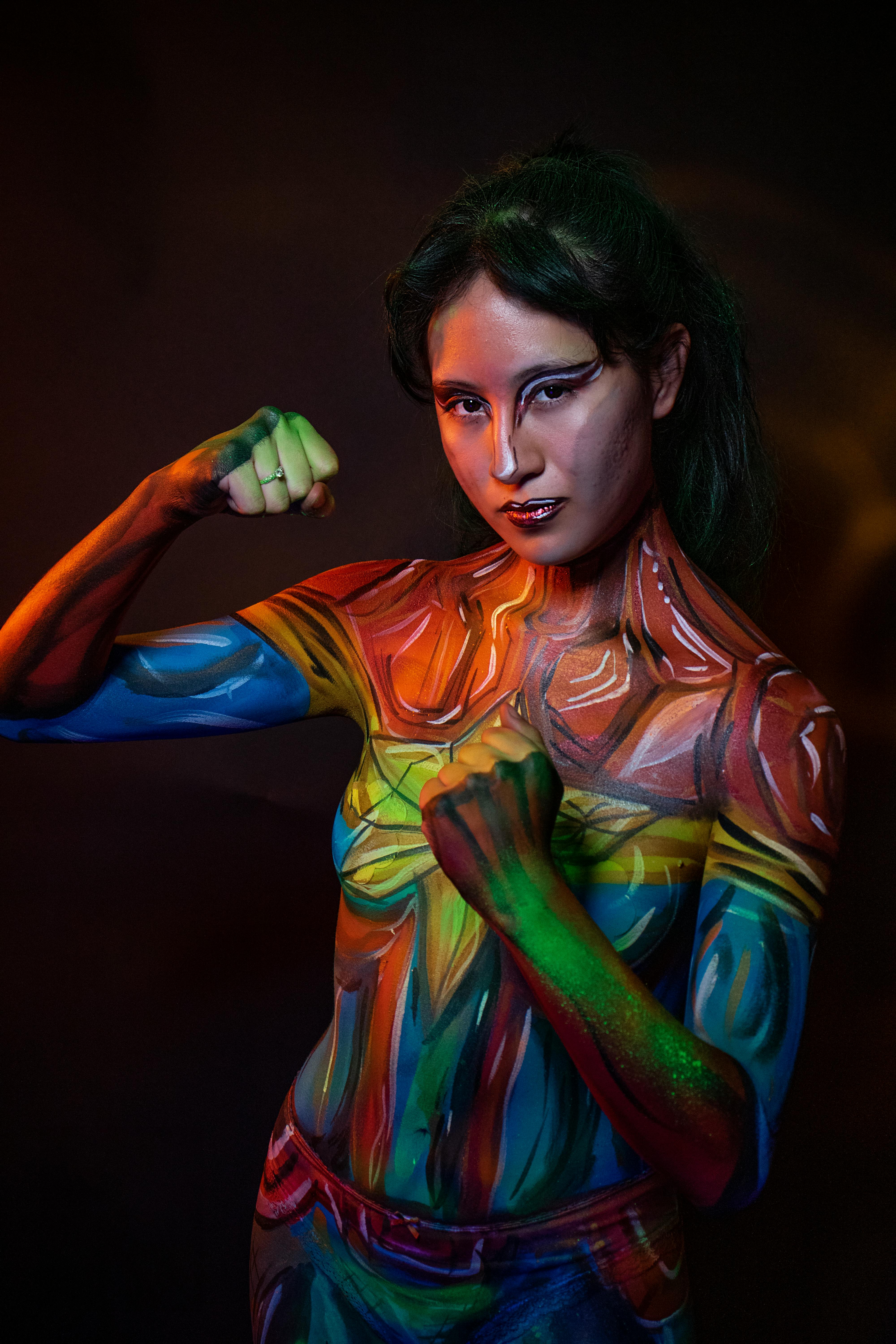 Colorful Body Art on Woman Posing Confidently · Free Stock Photo