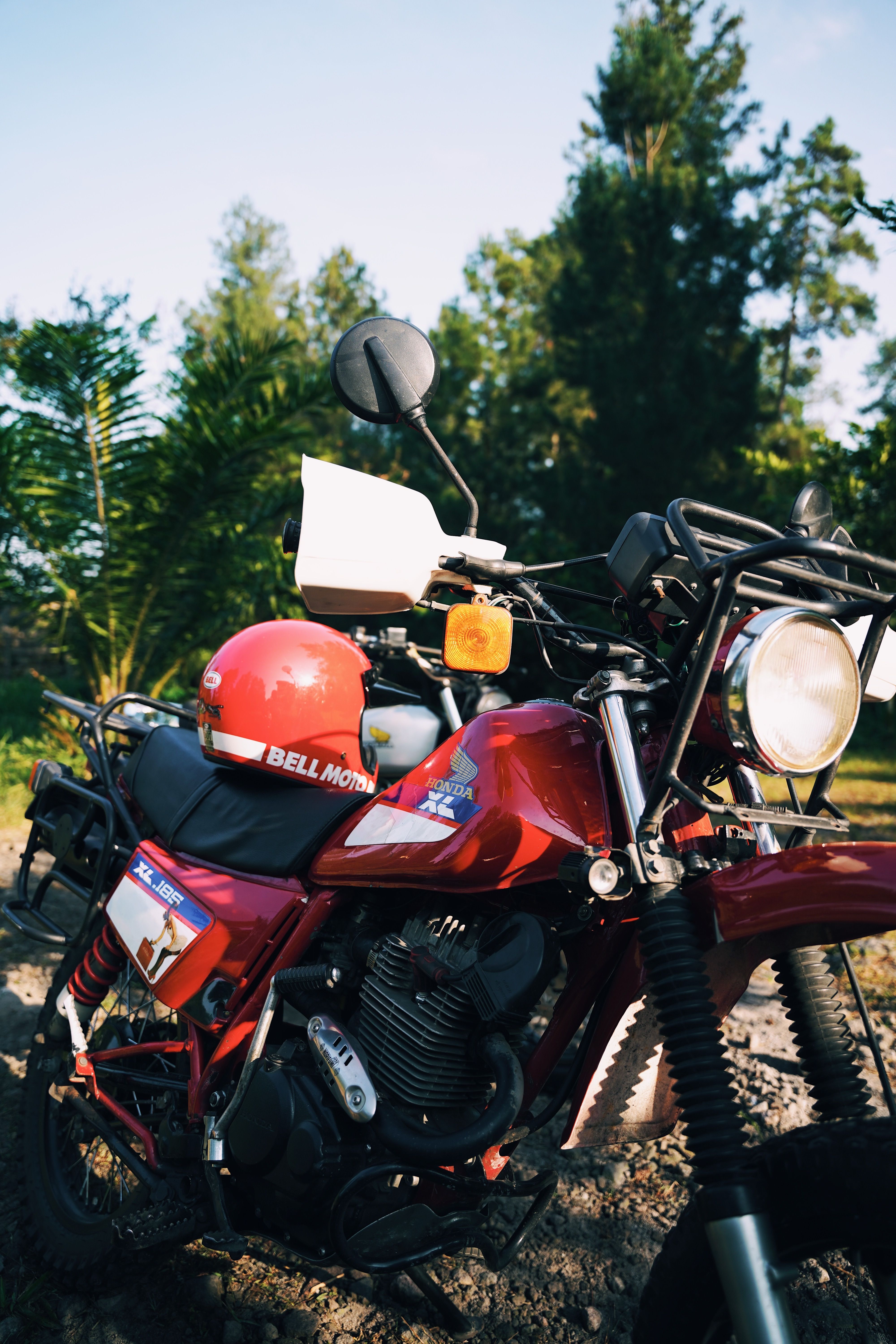 Red Motorcycle with Helmet in Outdoor Setting · Free Stock Photo