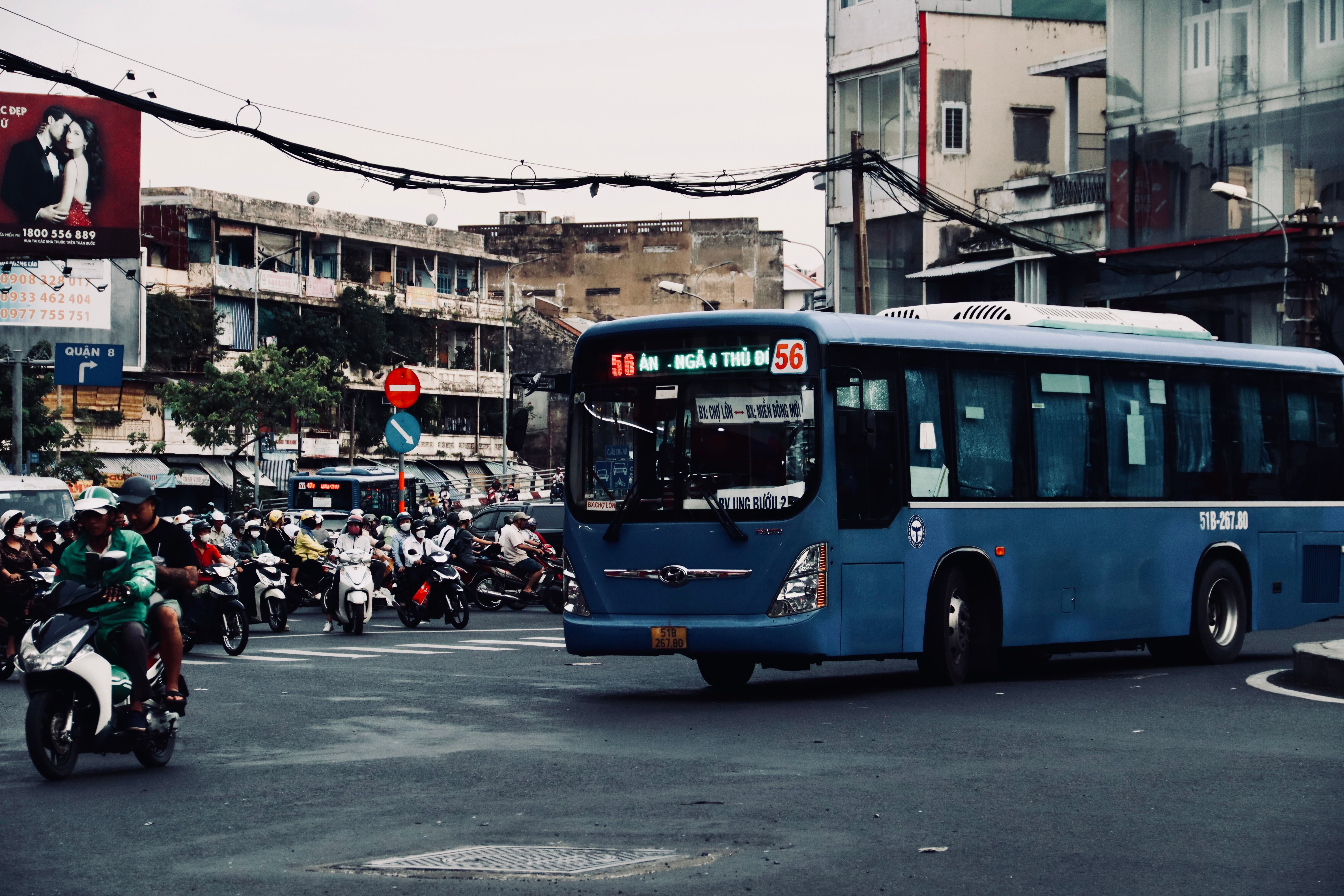 Urban Traffic Scene with Blue City Bus · Free Stock Photo